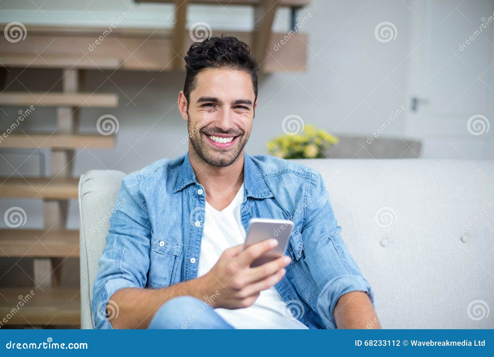 Smiling Smart Man Using Smartphone Stock Photo - Image of life, indoors ...