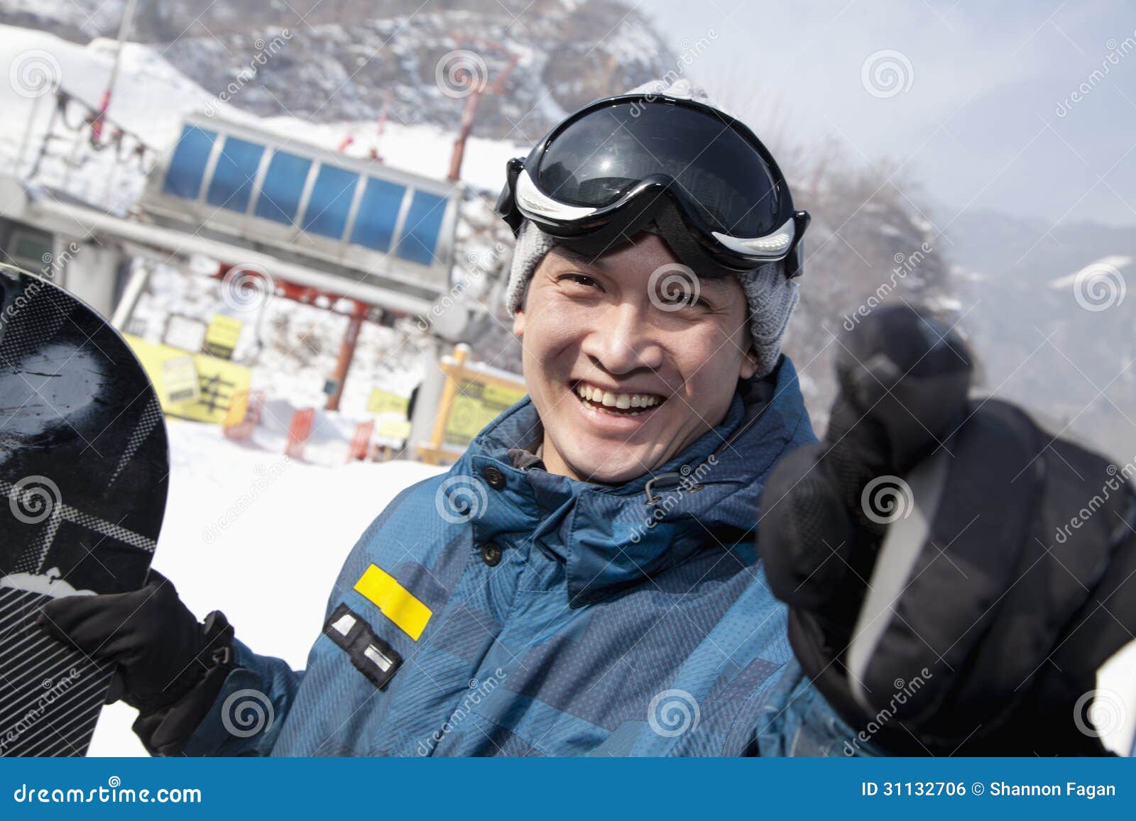 Smiling Snowboarder in Ski Resort Stock Photo - Image of china, away ...