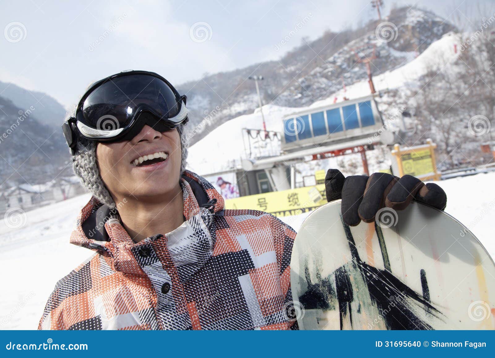 Smiling Snowboarder in Ski Resort Stock Photo - Image of destinations ...