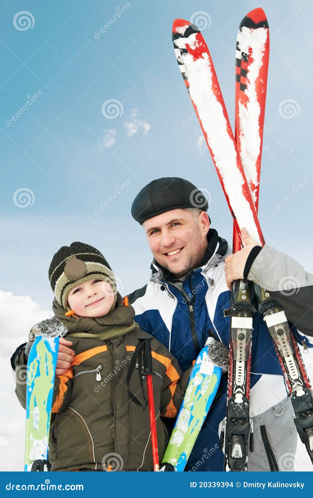 Smiling Son and Father with Skis at Stock Photo - Image of glad ...