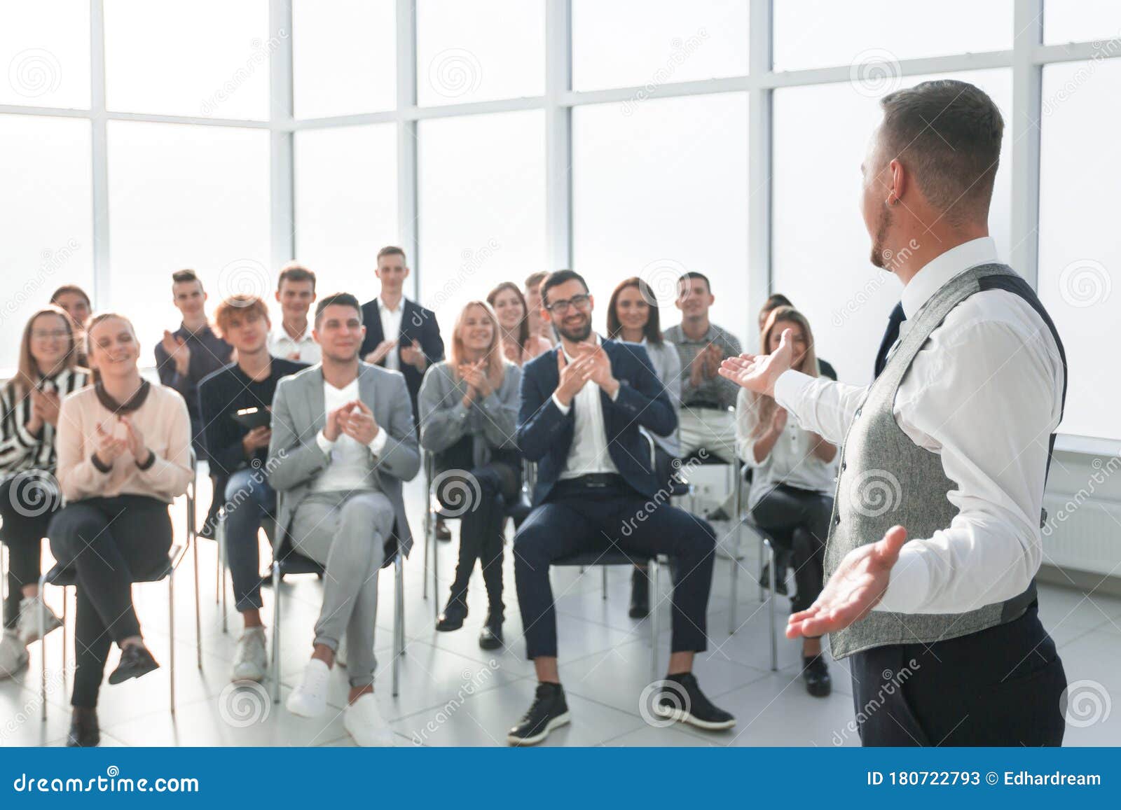 Smiling Speaker Standing in Front of an Applauding Audience Stock Image ...