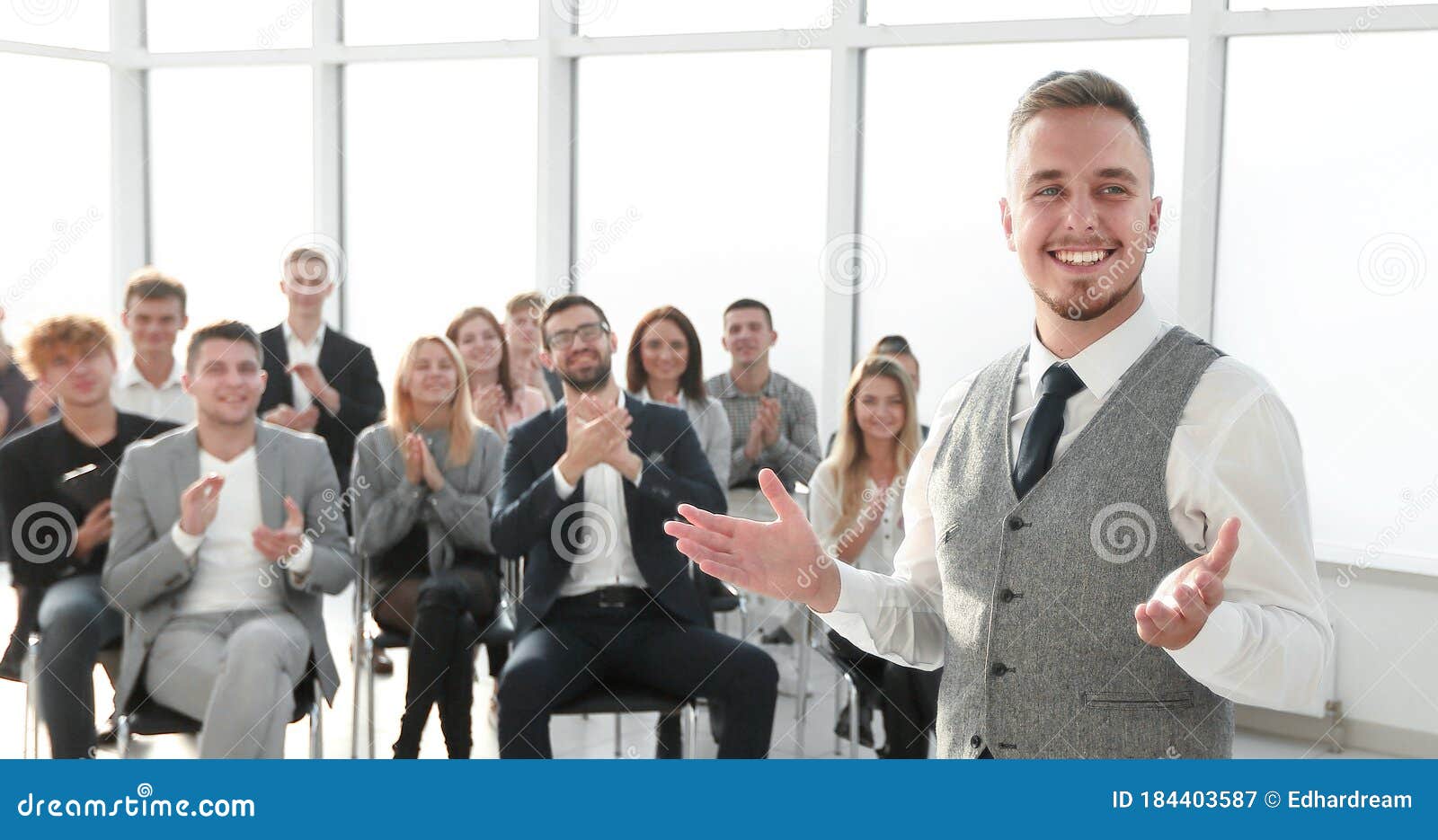 Smiling Speaker Standing in Front of an Applauding Audience Stock Image ...