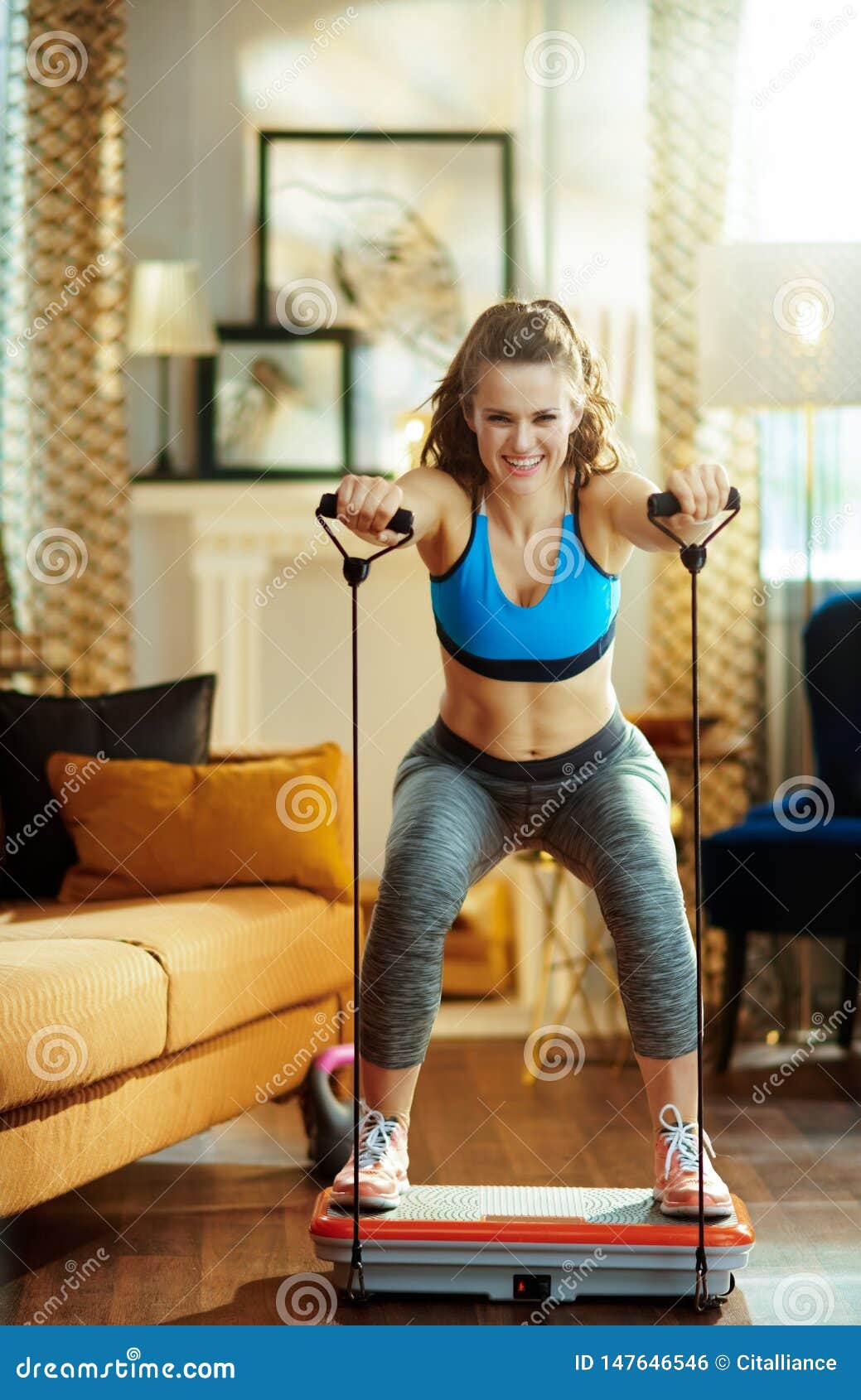 Smiling Sports Woman Training Using Vibration Power Plate Stock Photo ... Smiling Sports Woman Training Using Vibration Power Plate Stock Photo ...