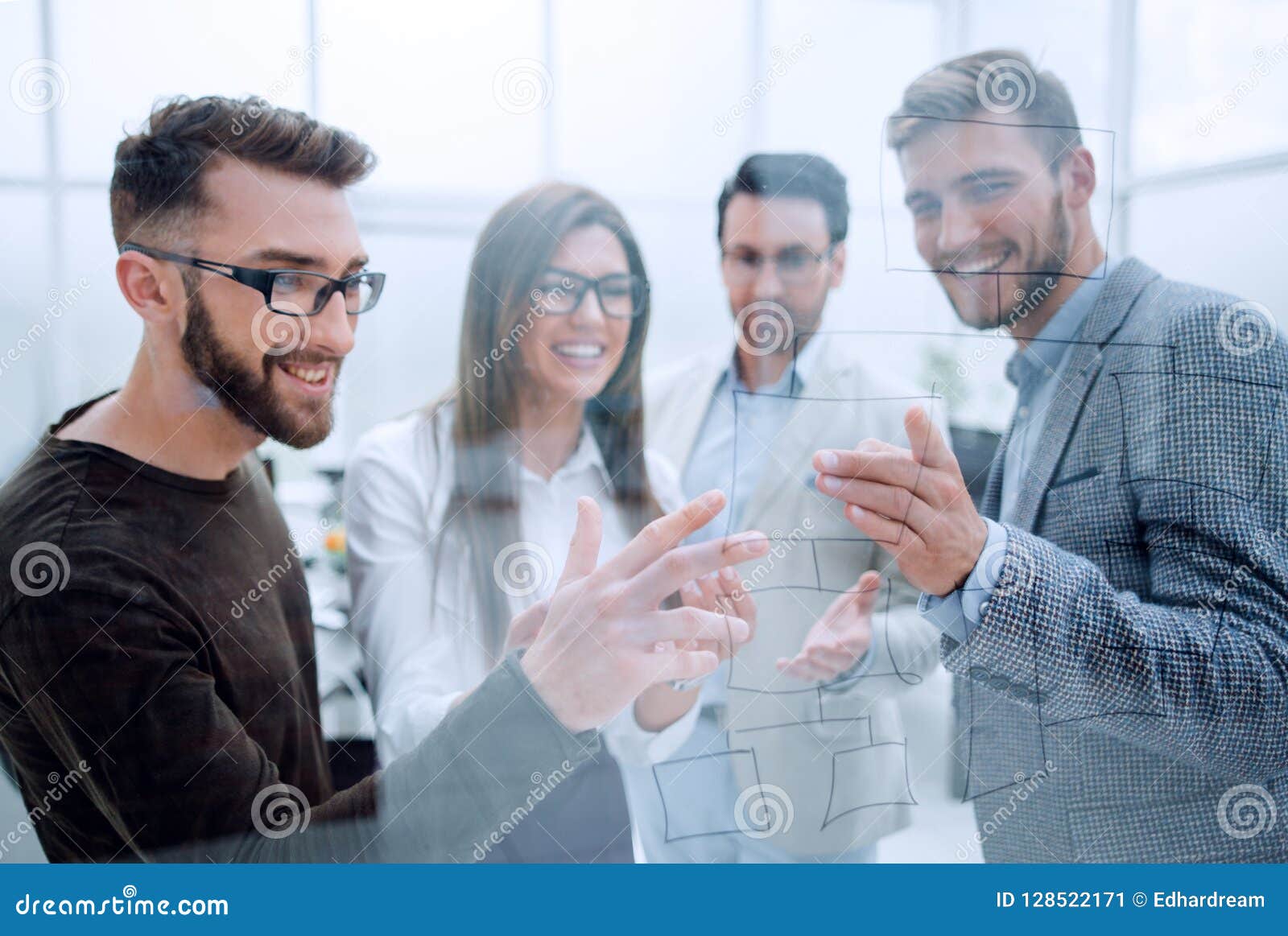 Smiling Staff Discussing Something Standing in the Office. Stock Image ...