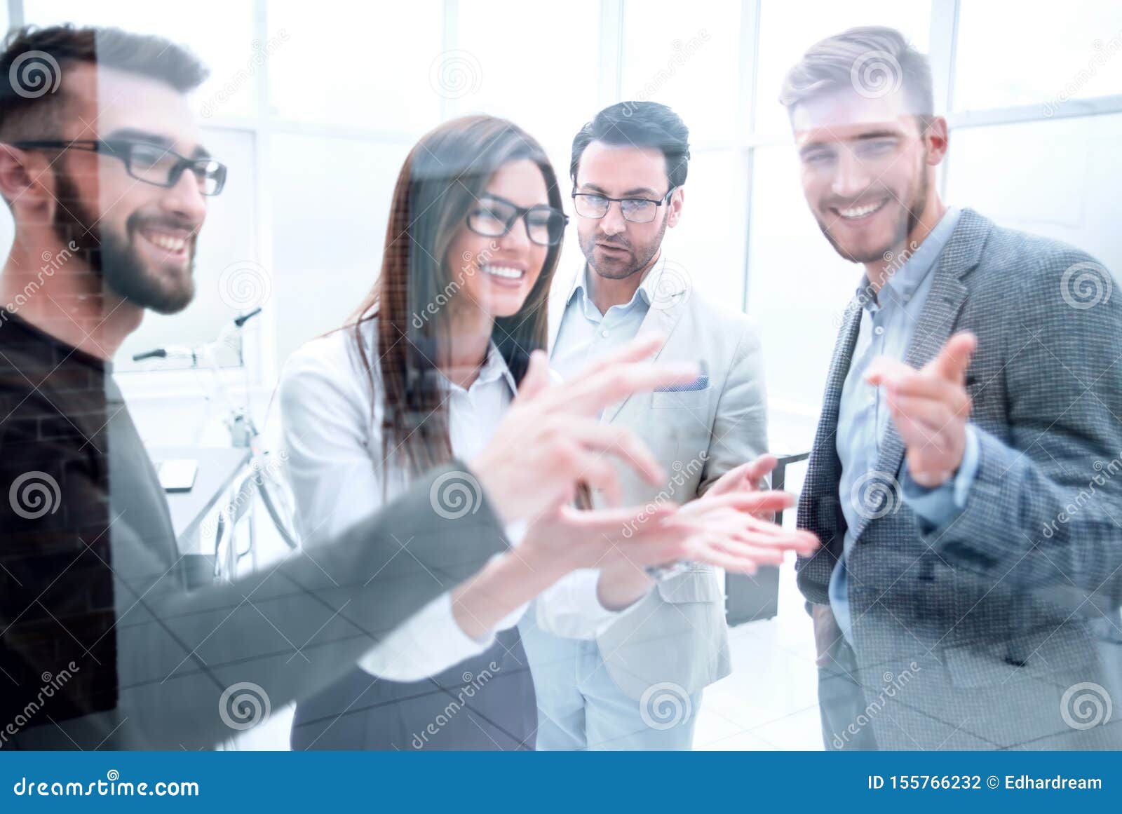 Smiling Staff Discussing Something Standing in the Office. Stock Photo ...