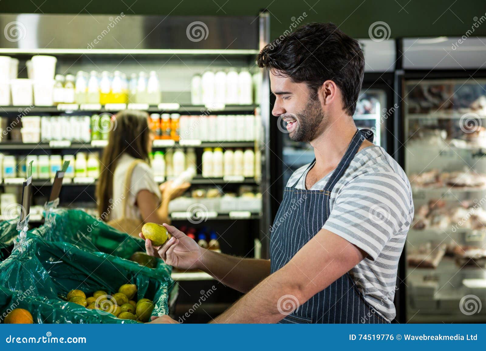 Smiling Staff Holding a Fruit in Organic Section Stock Photo - Image of ...