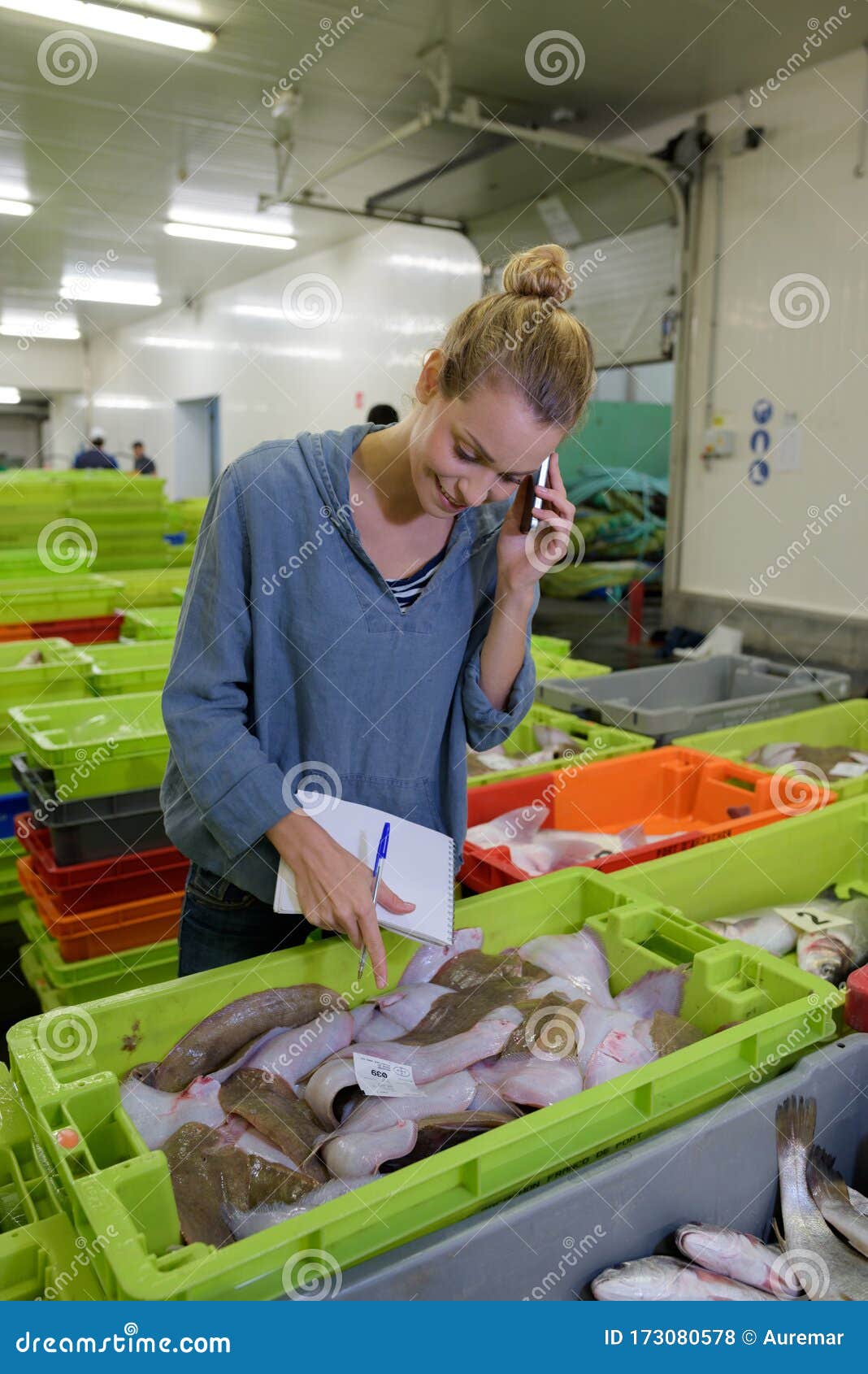 Smiling Staff on Phone with Packed Fish Stock Photo - Image of plant ...