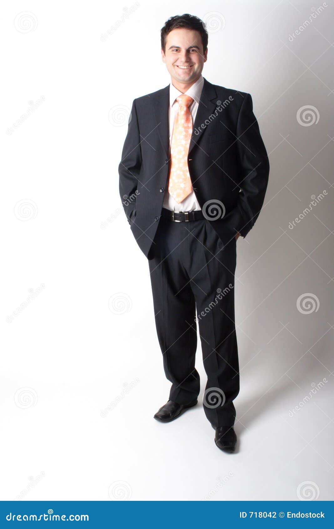 Smiling Standing White Businessman In Suit With Hands In Pockets Stock ... Smiling Standing White Businessman In Suit With Hands In Pockets Stock ...