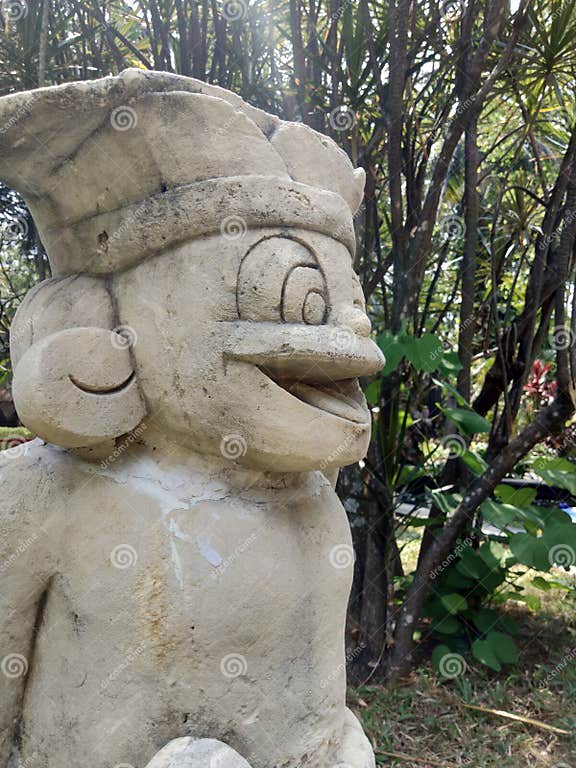 Smiling statue by the pool stock image. Image of smiling - 265984323