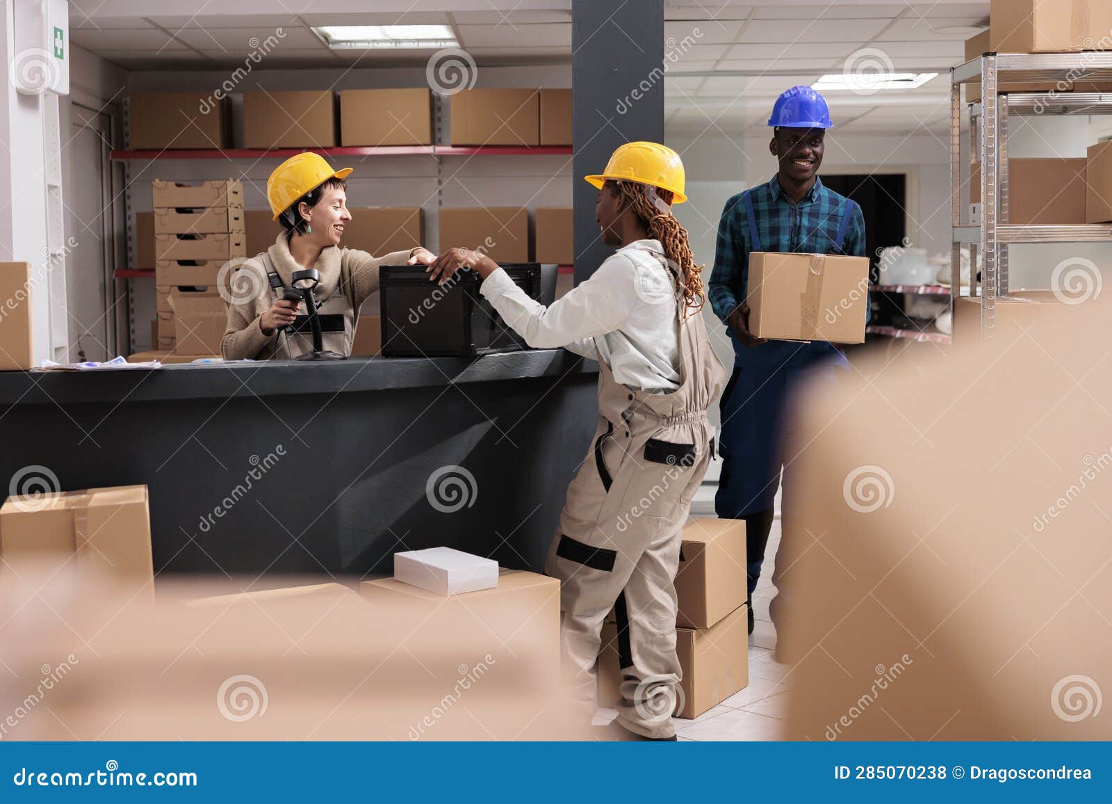 Smiling Storehouse Operators Chatting at Reception Desk Doing Inventory ...