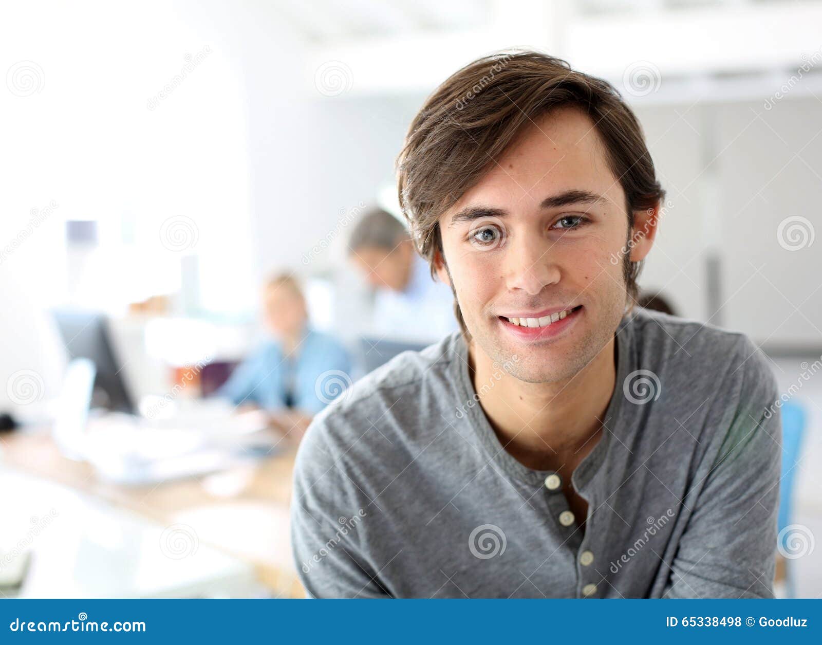 Smiling student in class stock photo. Image of years - 65338498