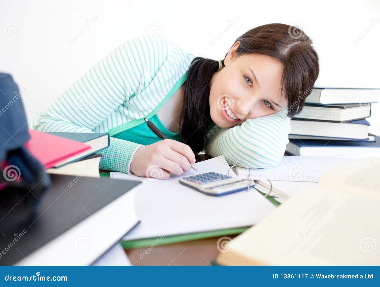 Smiling Student Doing Her Homework on a Desk Stock Image - Image of ...