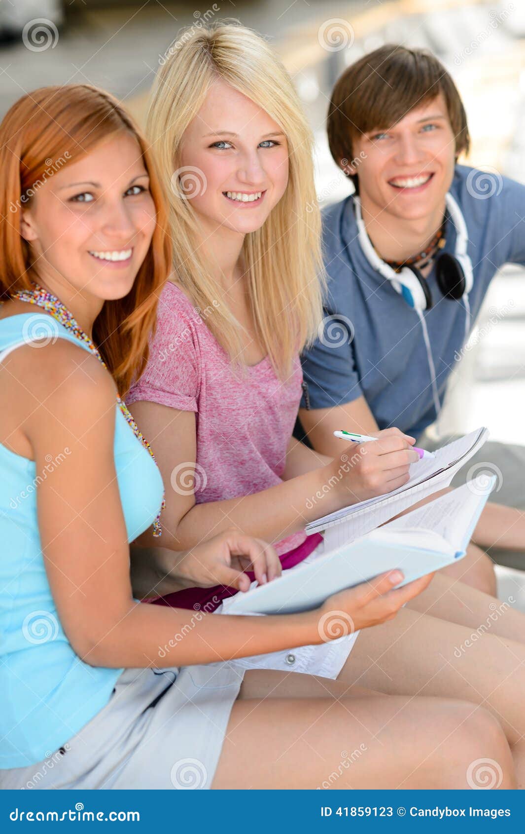 Smiling Student Friends Sitting Together Studying Stock Image - Image ...