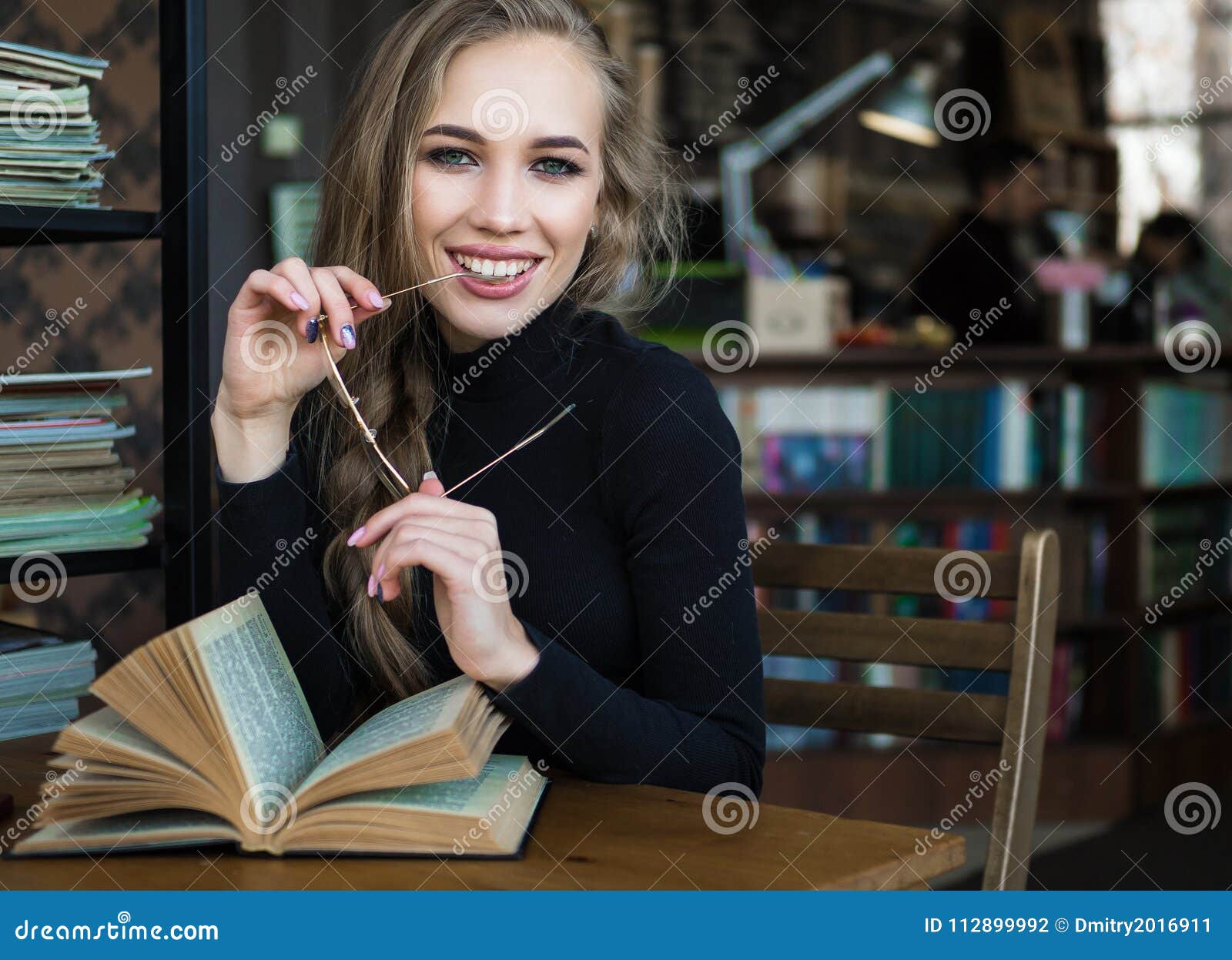 Smiling Student Girl at the Library Studying with Books Stock Photo ...