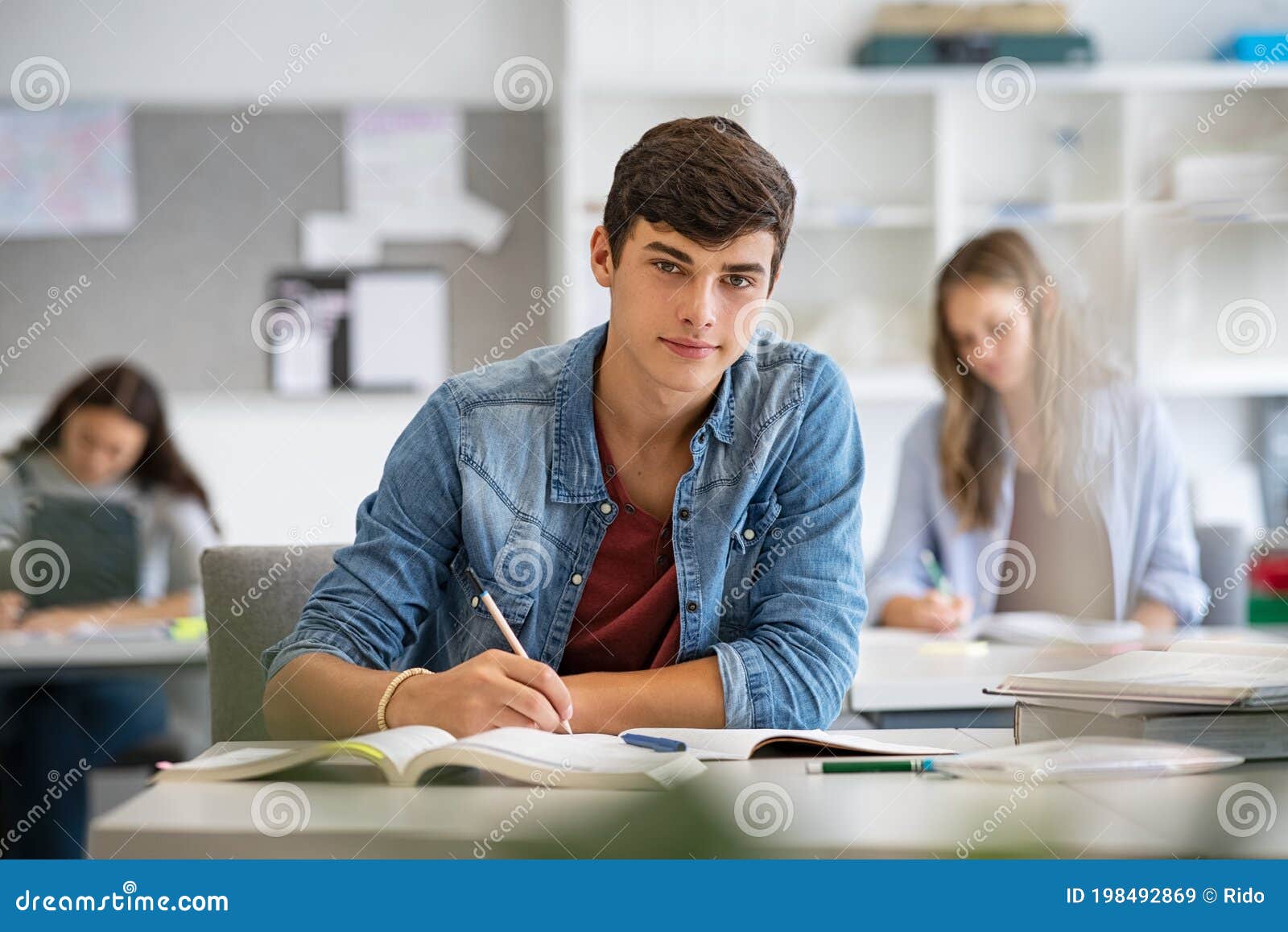 Smiling Student Guy Preparing for Exam at School Stock Image - Image of ...