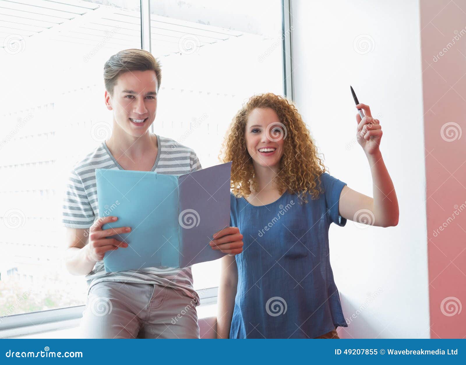 Smiling Student Holding Notebook and Pen Stock Image - Image of ...