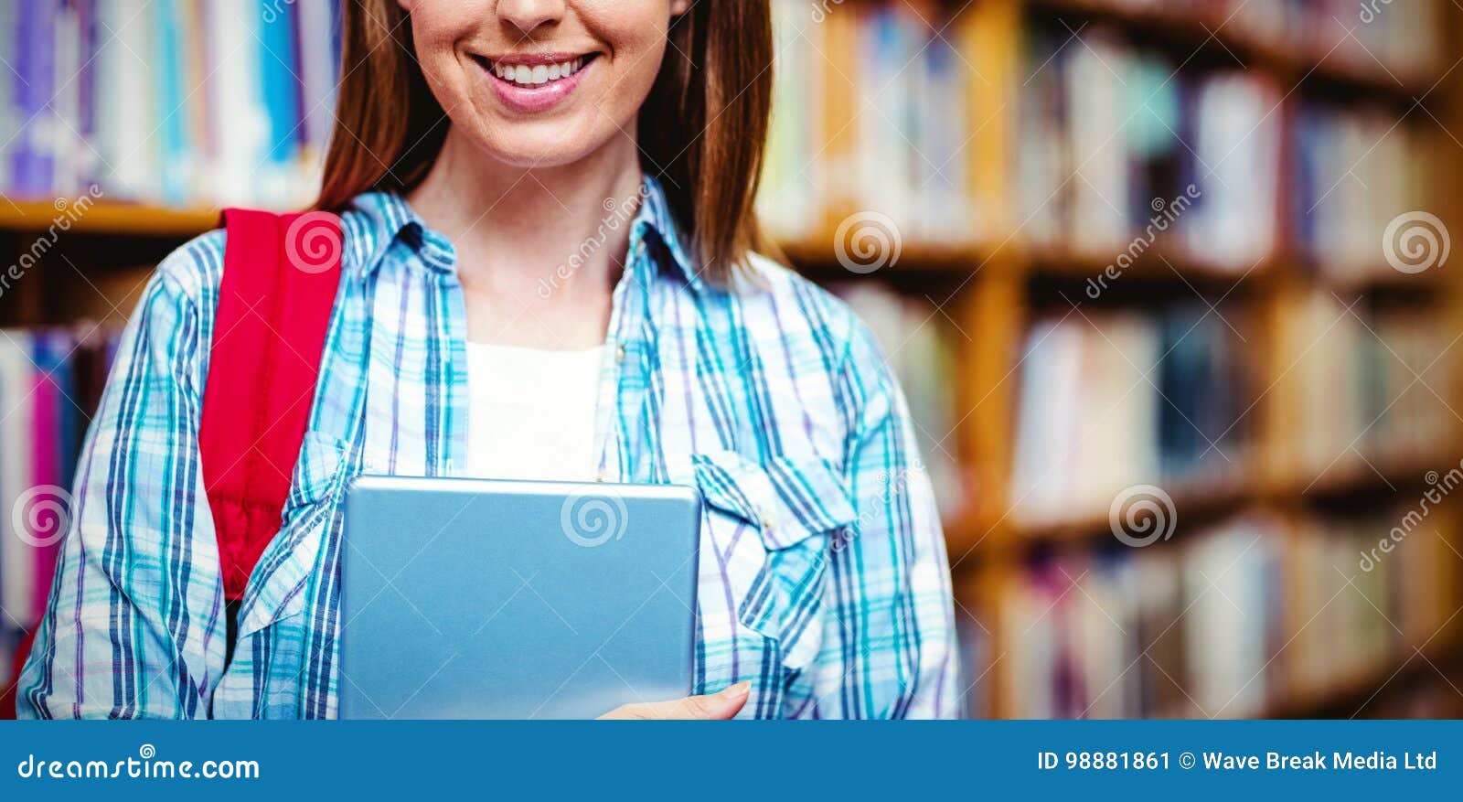 Smiling Student Holding Tablet in Library Stock Image - Image of campus ...