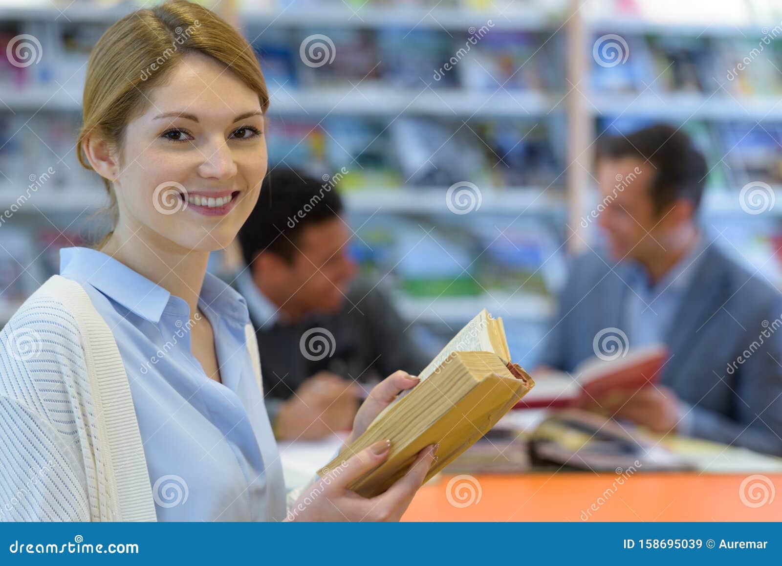 Smiling Student Reading Book in Library Stock Image - Image of ...