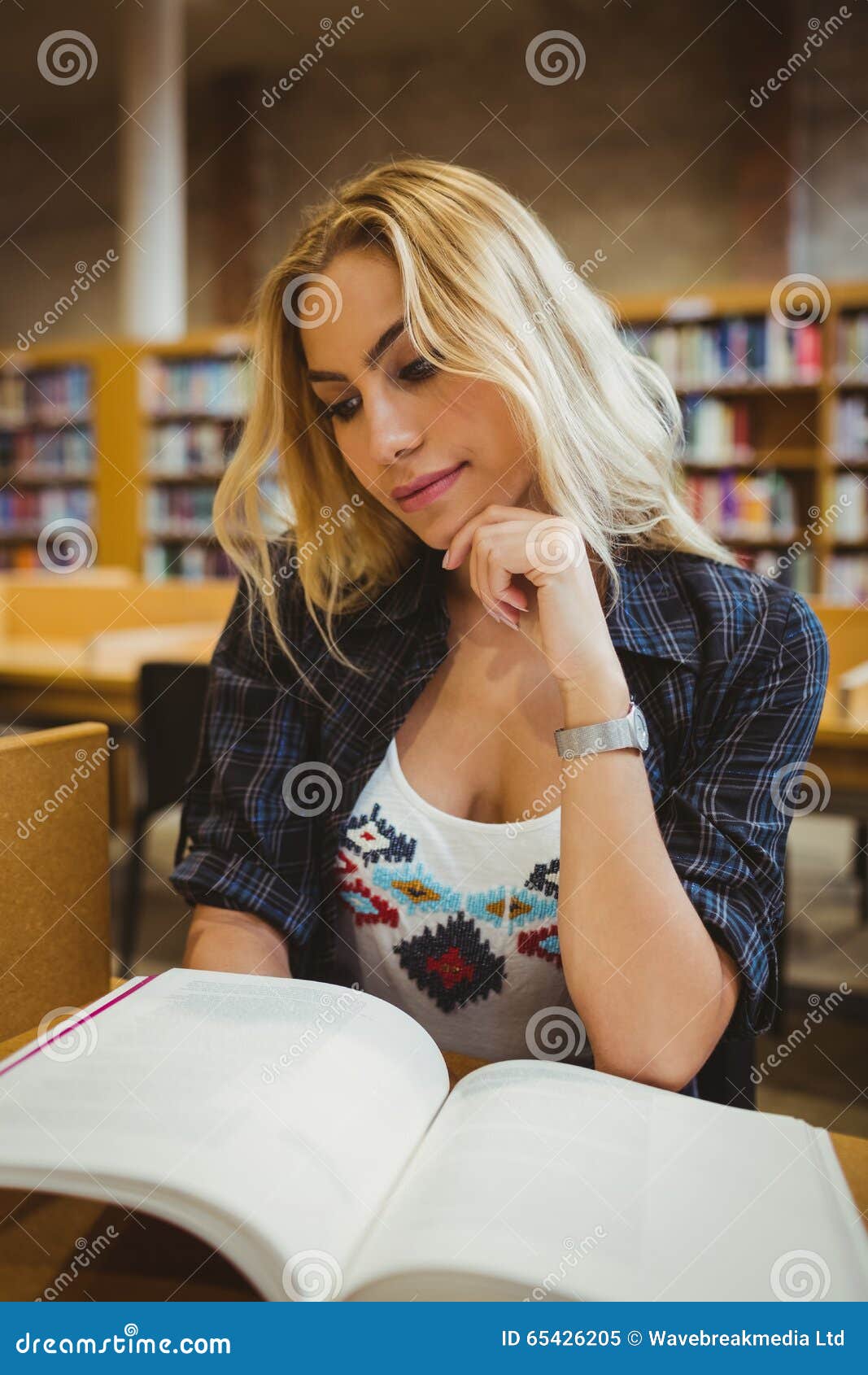 Smiling Student Reading a Book at Table Stock Image - Image of academic ...