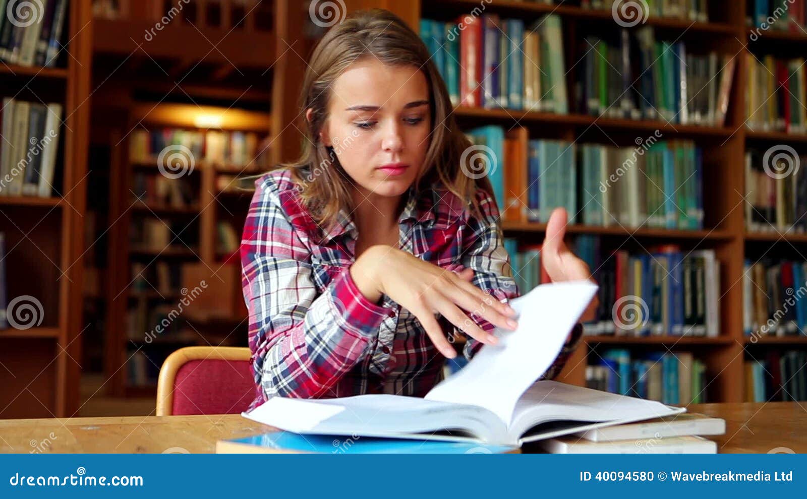 Smiling Student Studying at Desk in the Library Stock Footage - Video ...