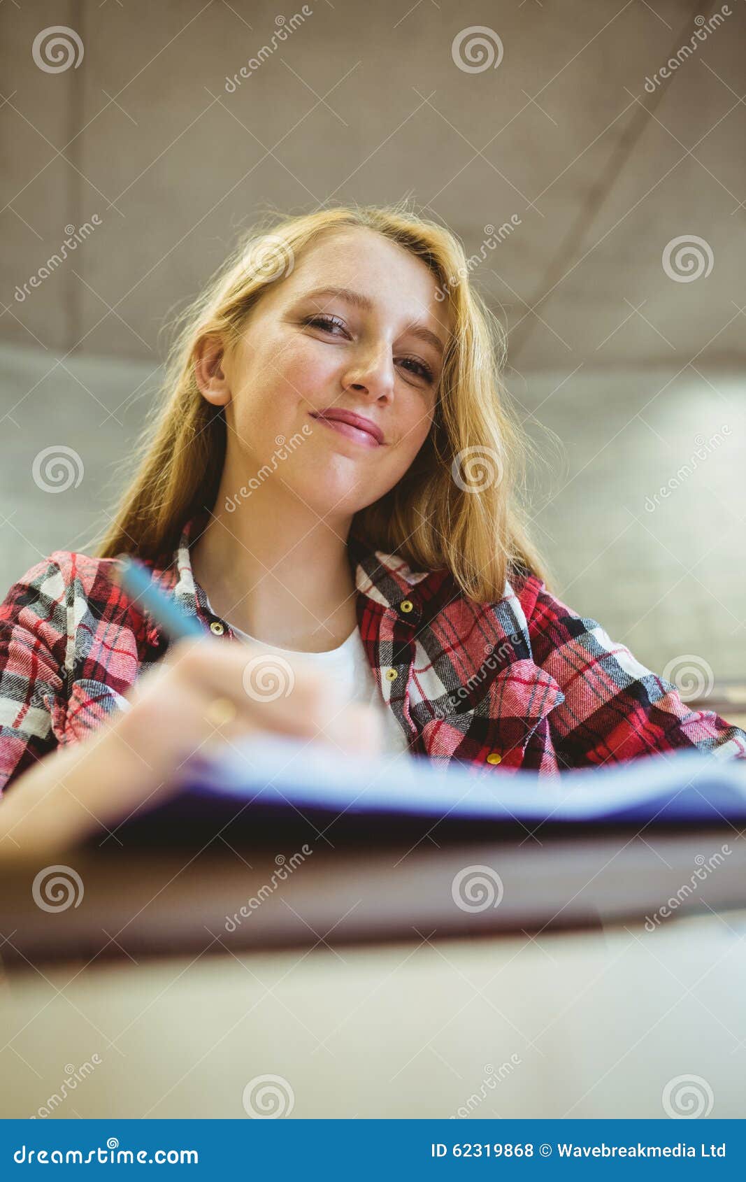 Smiling Student Taking Notes during Class Stock Photo - Image of hall ...