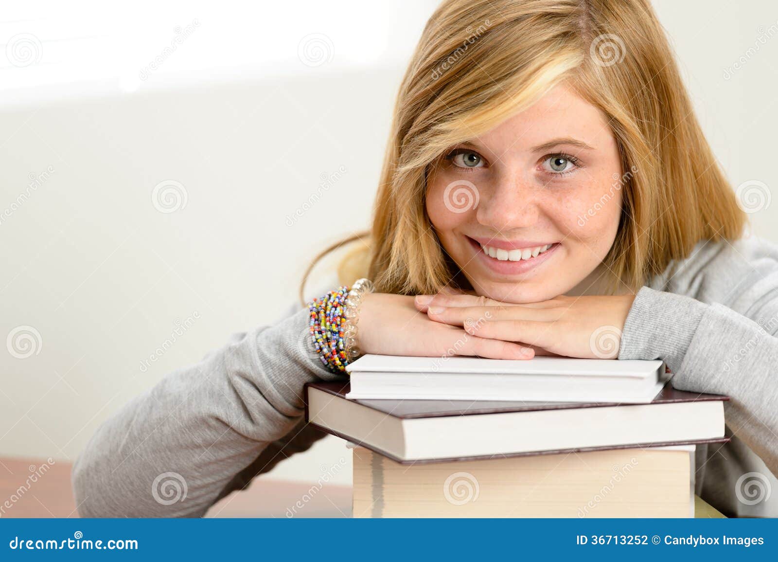 Smiling Student Teenager Leaning Head on Books Stock Photo - Image of ...