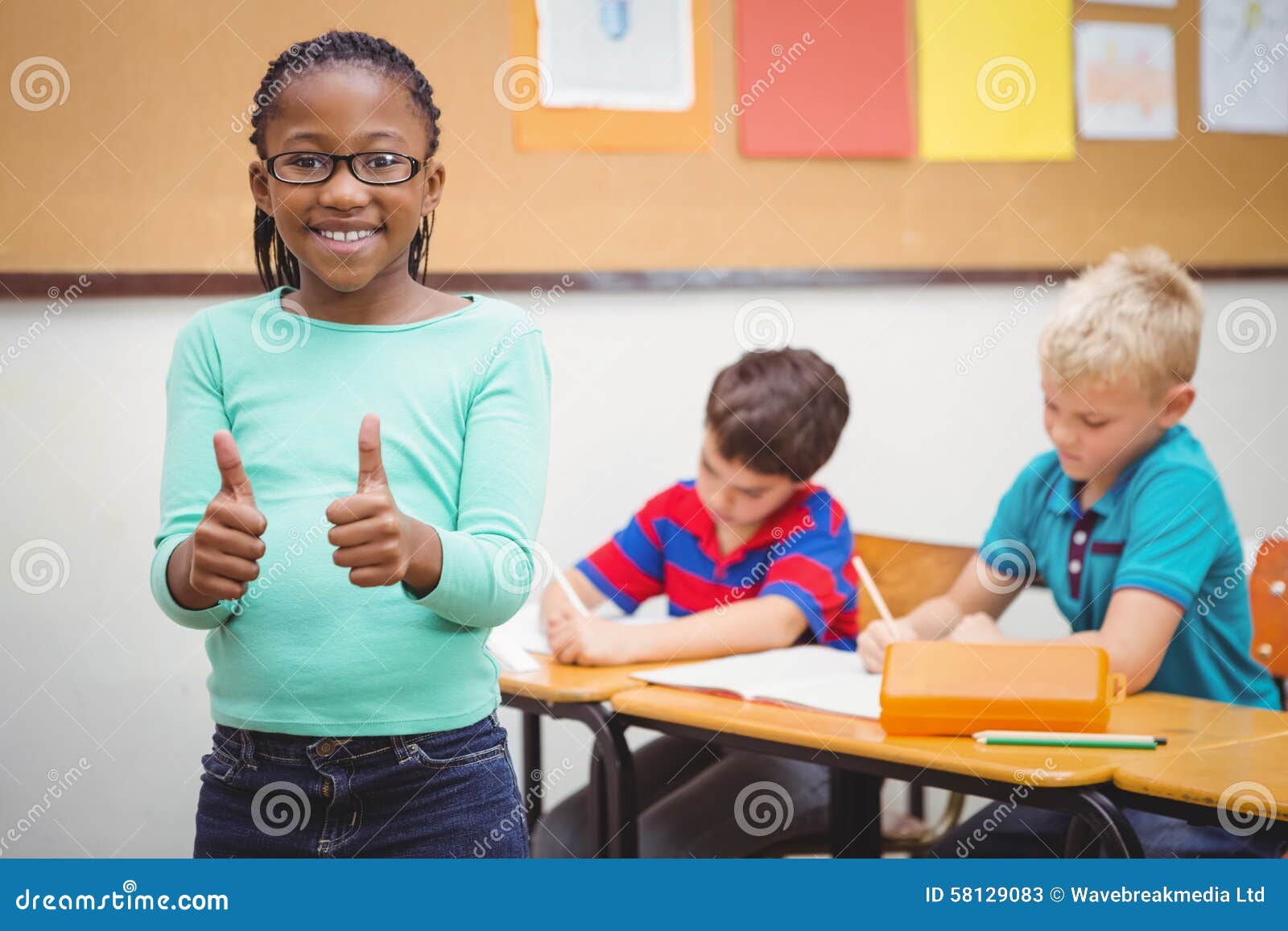 Smiling Student with Thumbs Up Stock Image - Image of classmates, early ...