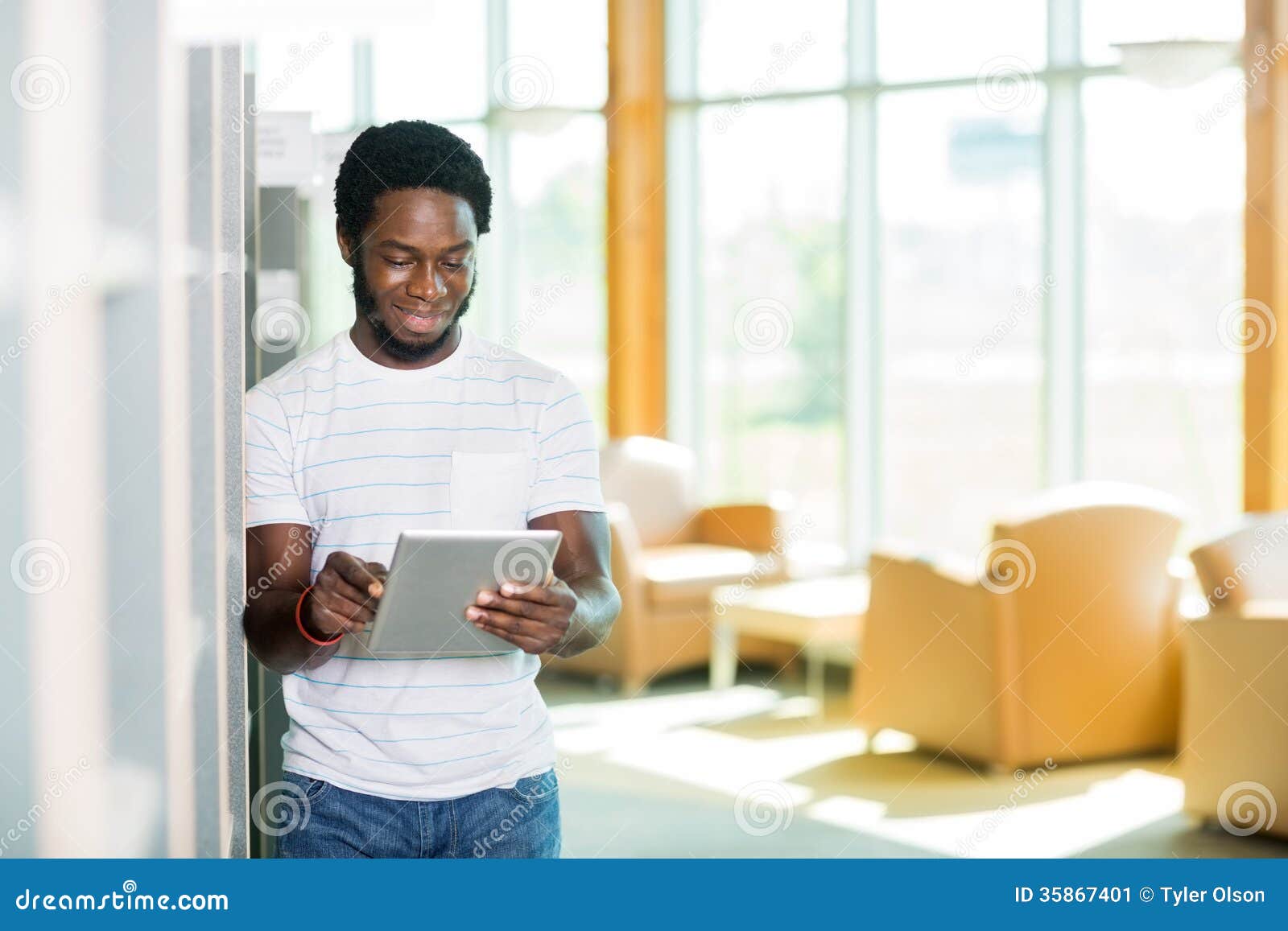 Smiling Student Using Digital Tablet at Library Stock Image - Image of ...