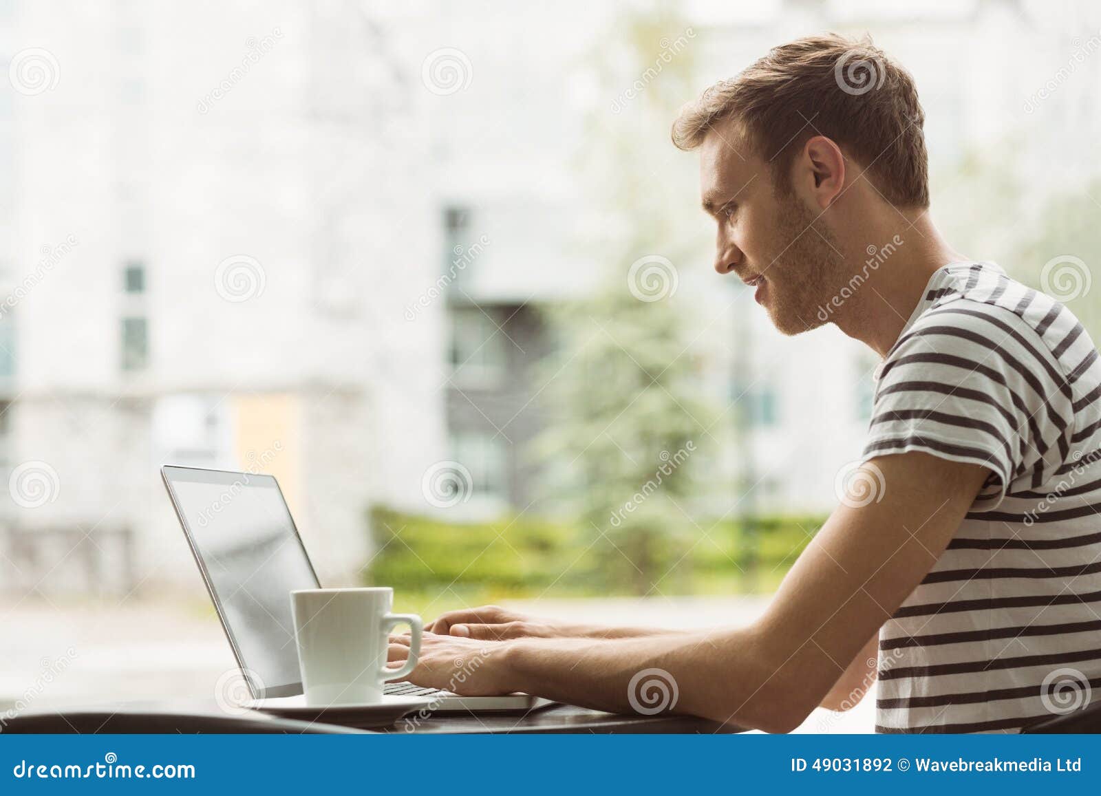 Smiling Student Using Laptop in Cafe Stock Photo - Image of male ...