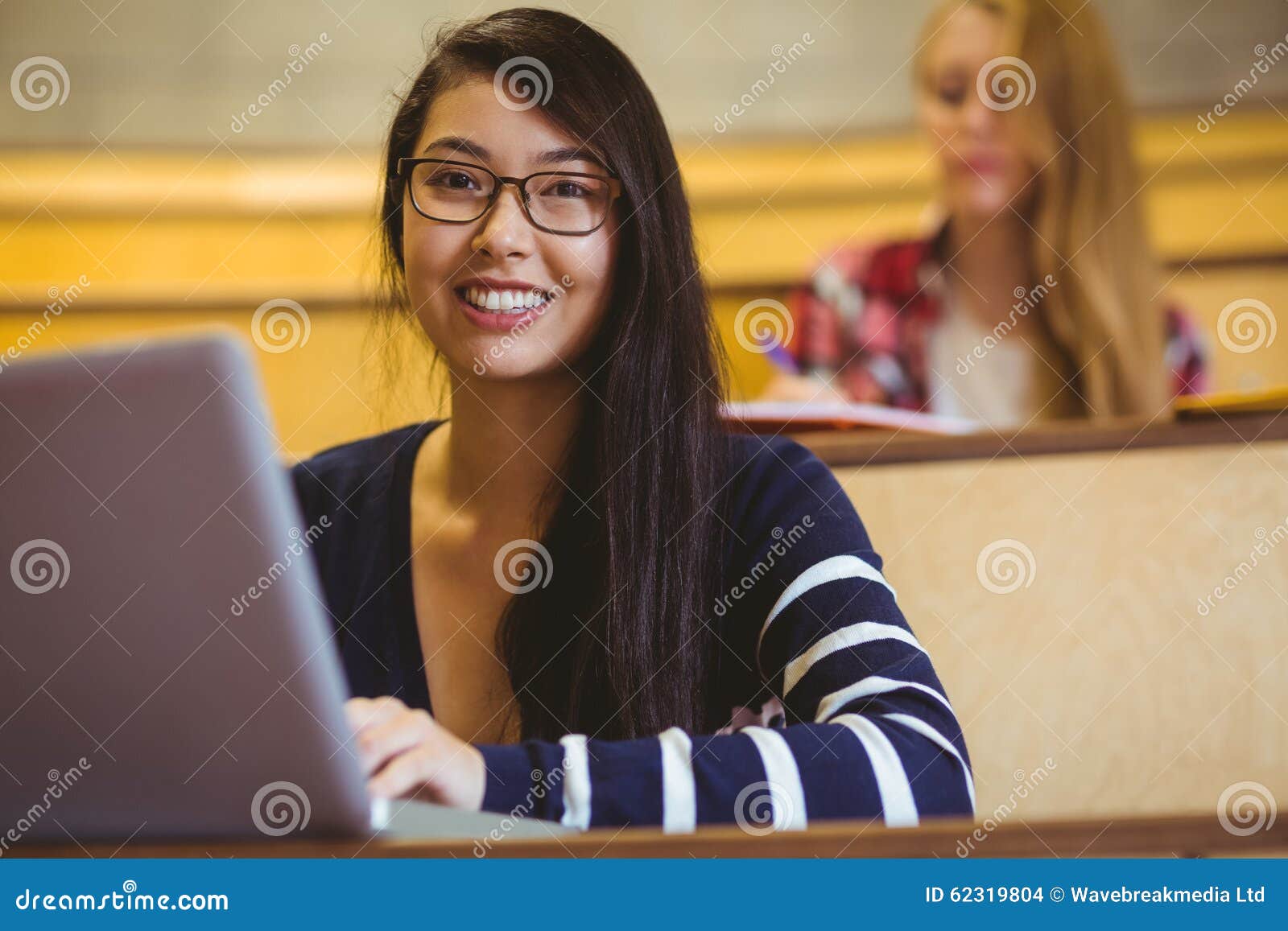 Smiling Student Using Laptop during Class Stock Photo - Image of higher ...