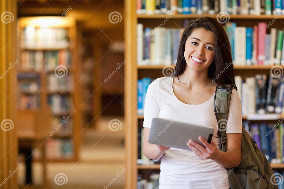 Smiling Student Using a Tablet Computer Stock Image - Image of miced ...