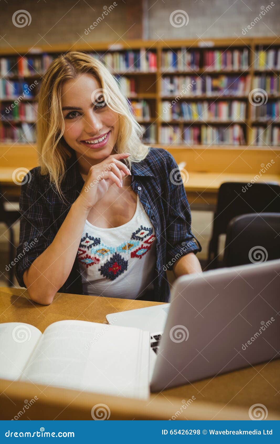 Smiling Student Working while Using Her Laptop Stock Photo - Image of ...