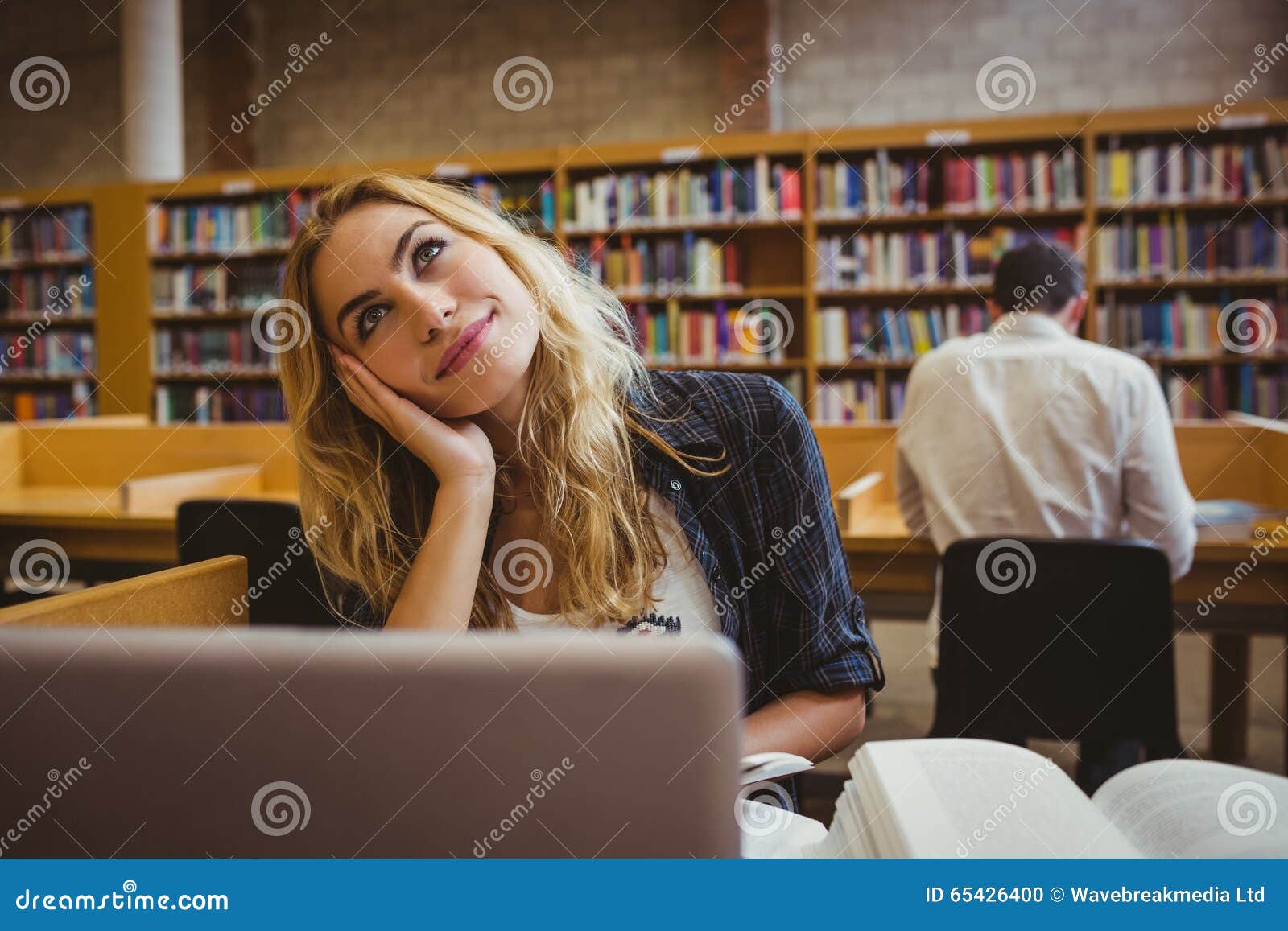 Smiling Student Working while Using Her Laptop Stock Photo - Image of ...