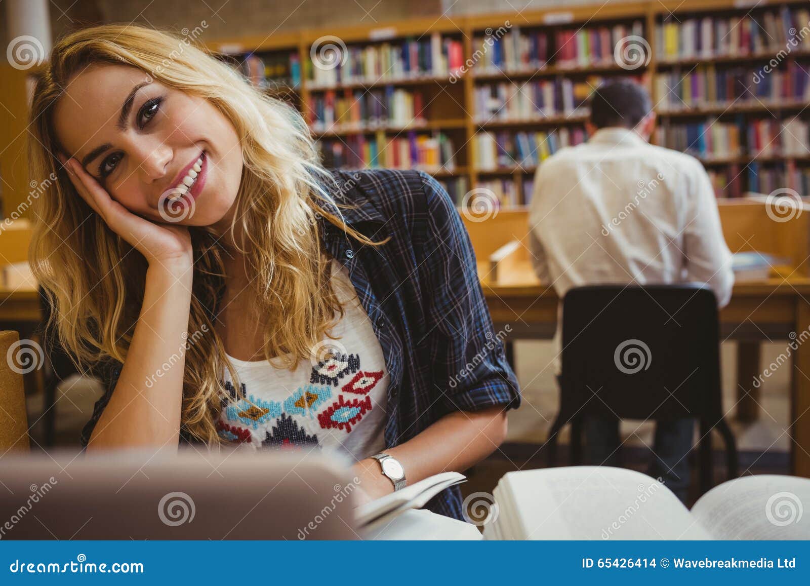 Smiling Student Working while Using Her Laptop Stock Photo - Image of ...