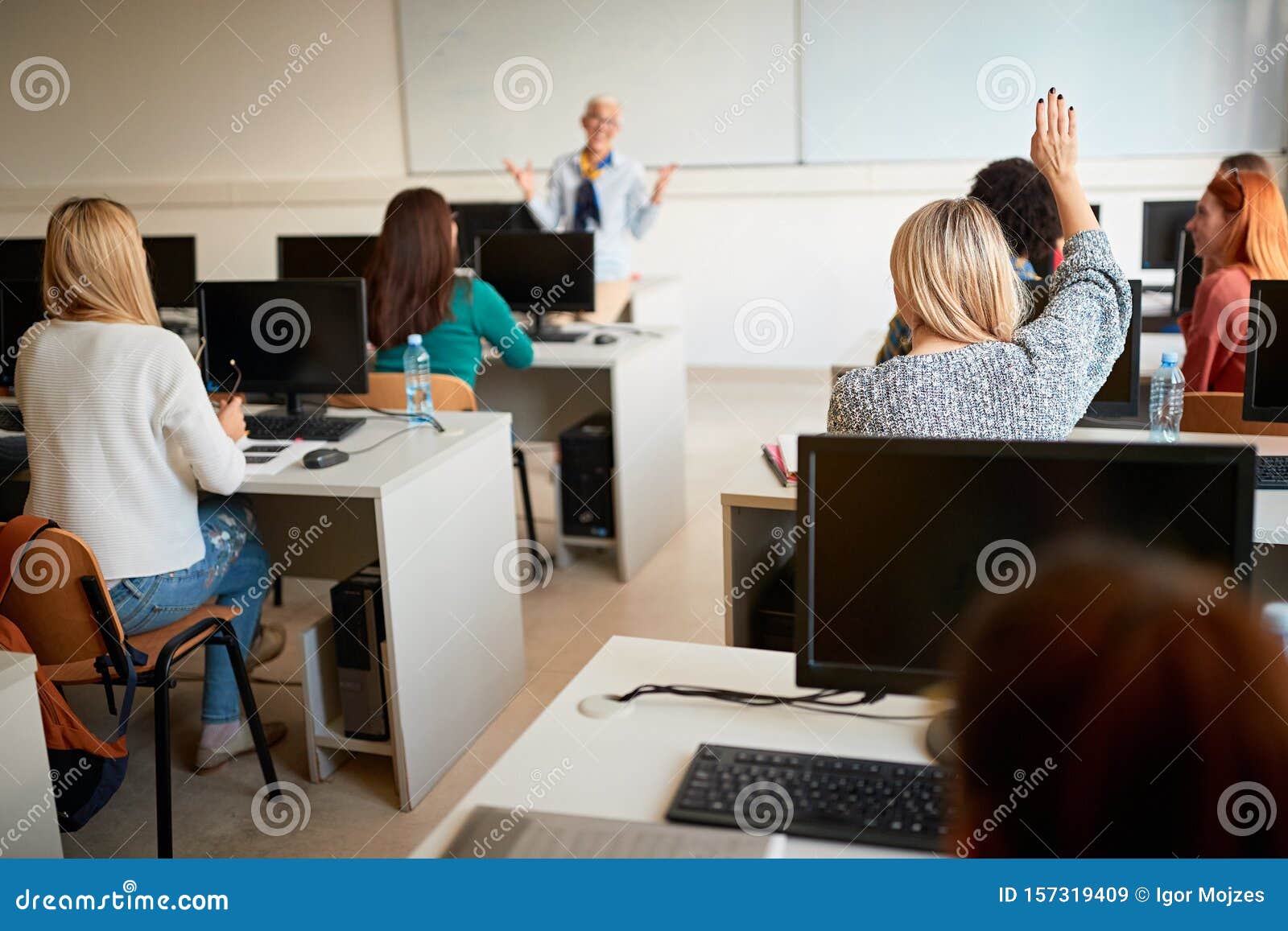 Students Asking Female Professor For Help At An Informatics Lecture ...