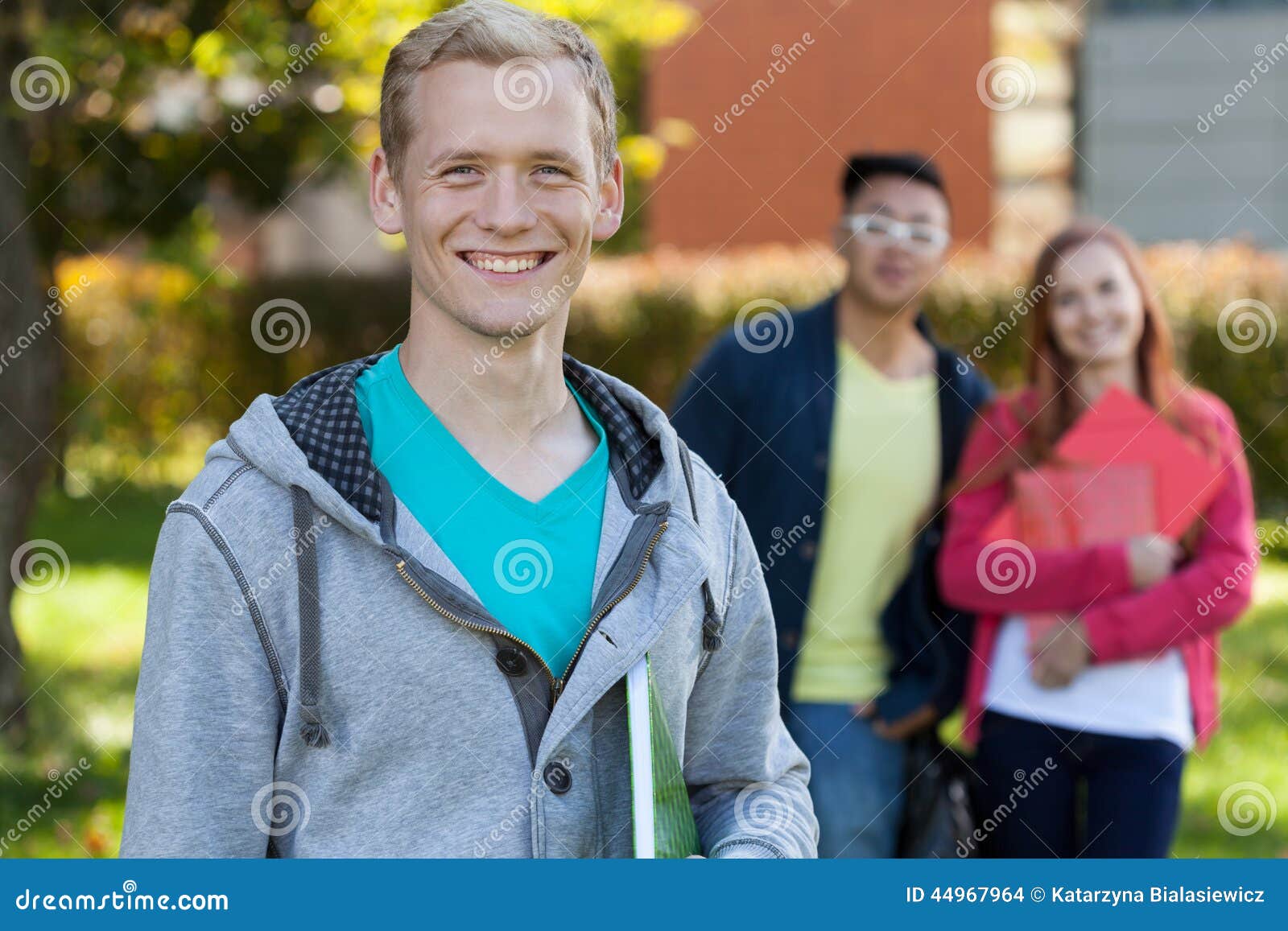 Smiling Students in Front of School Stock Photo - Image of education ...
