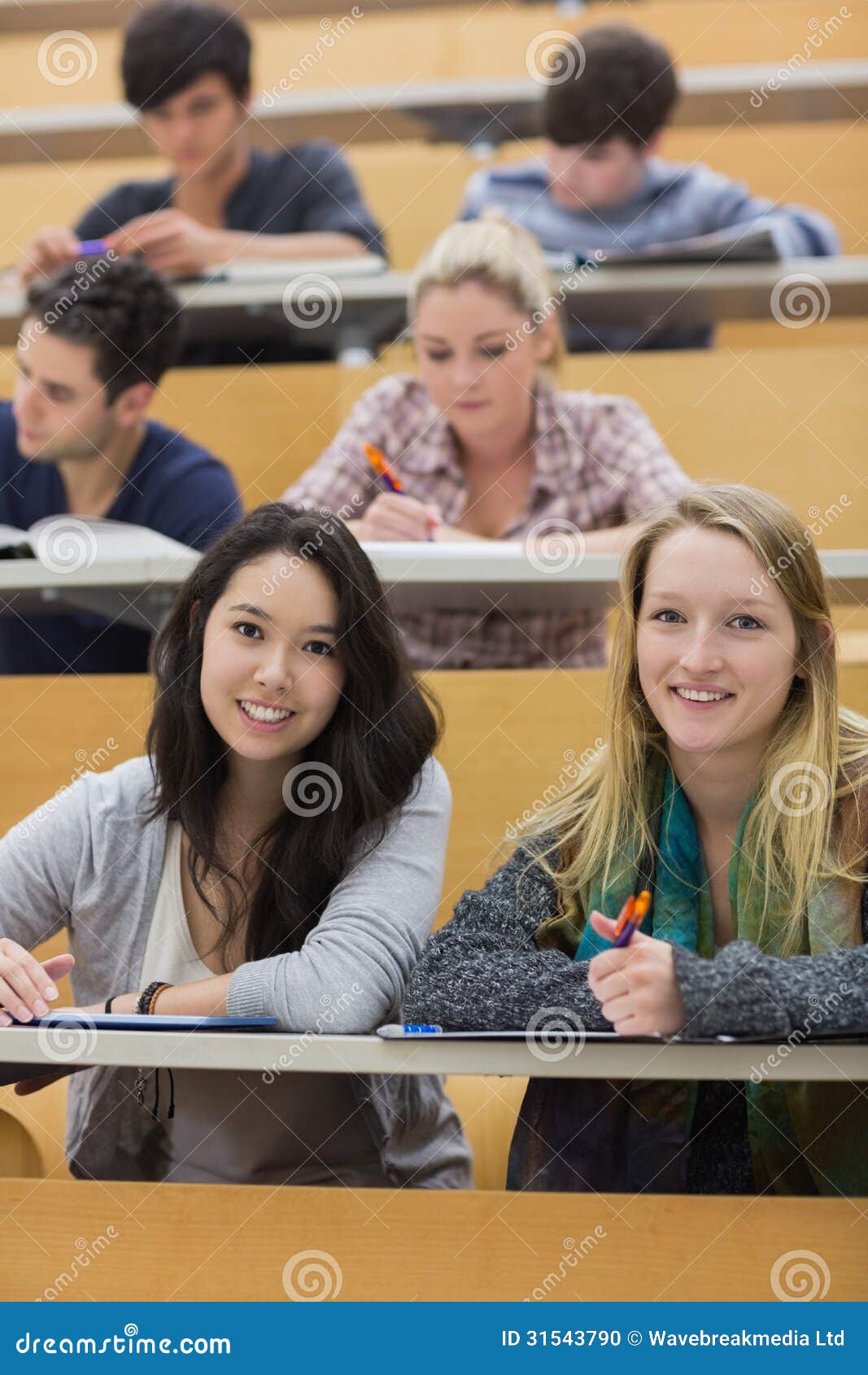 Smiling Students in a Lecture Stock Photo - Image of caucasian, adult ...
