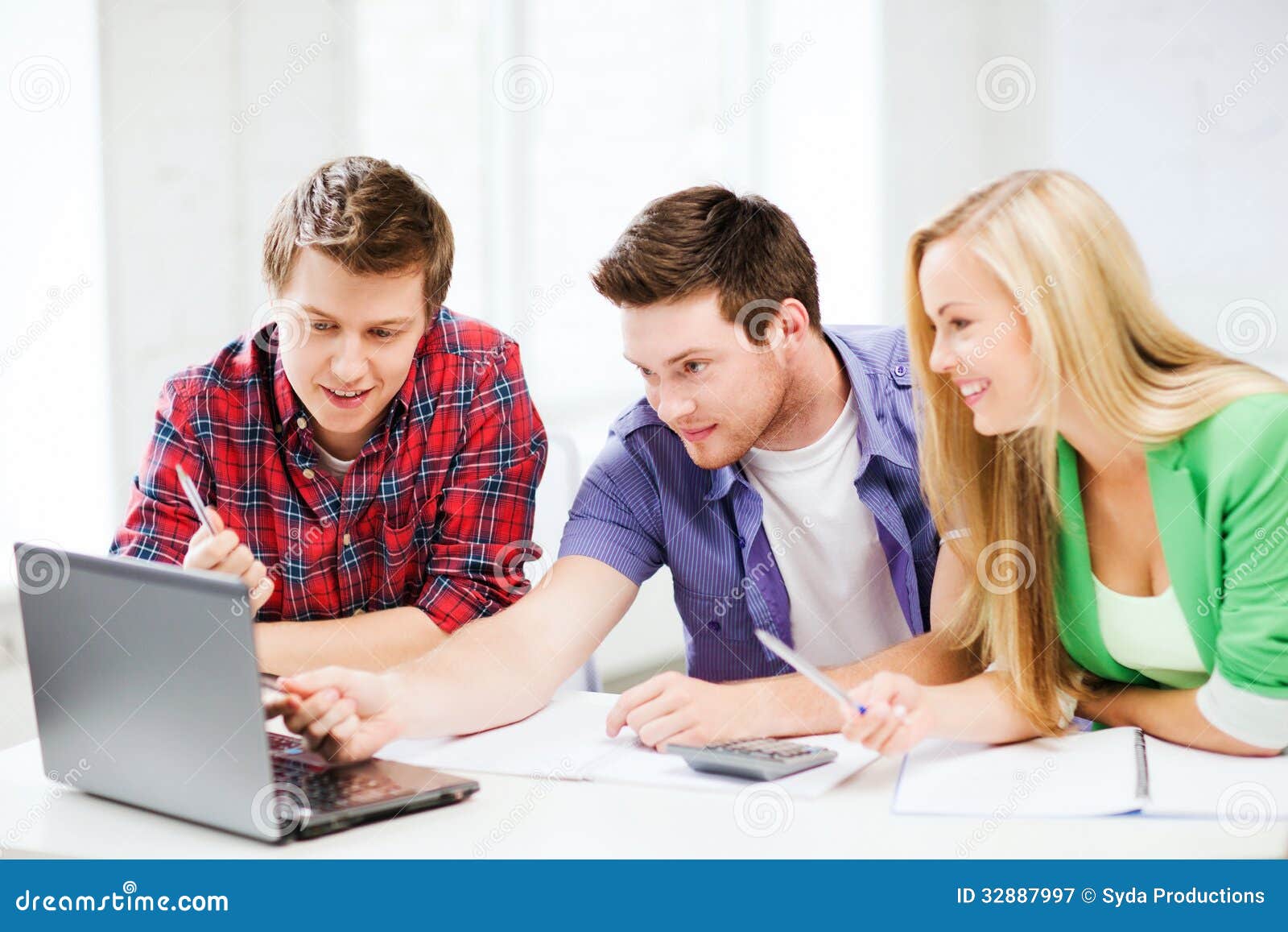 Smiling Students Looking at Laptop at School Stock Image - Image of ...
