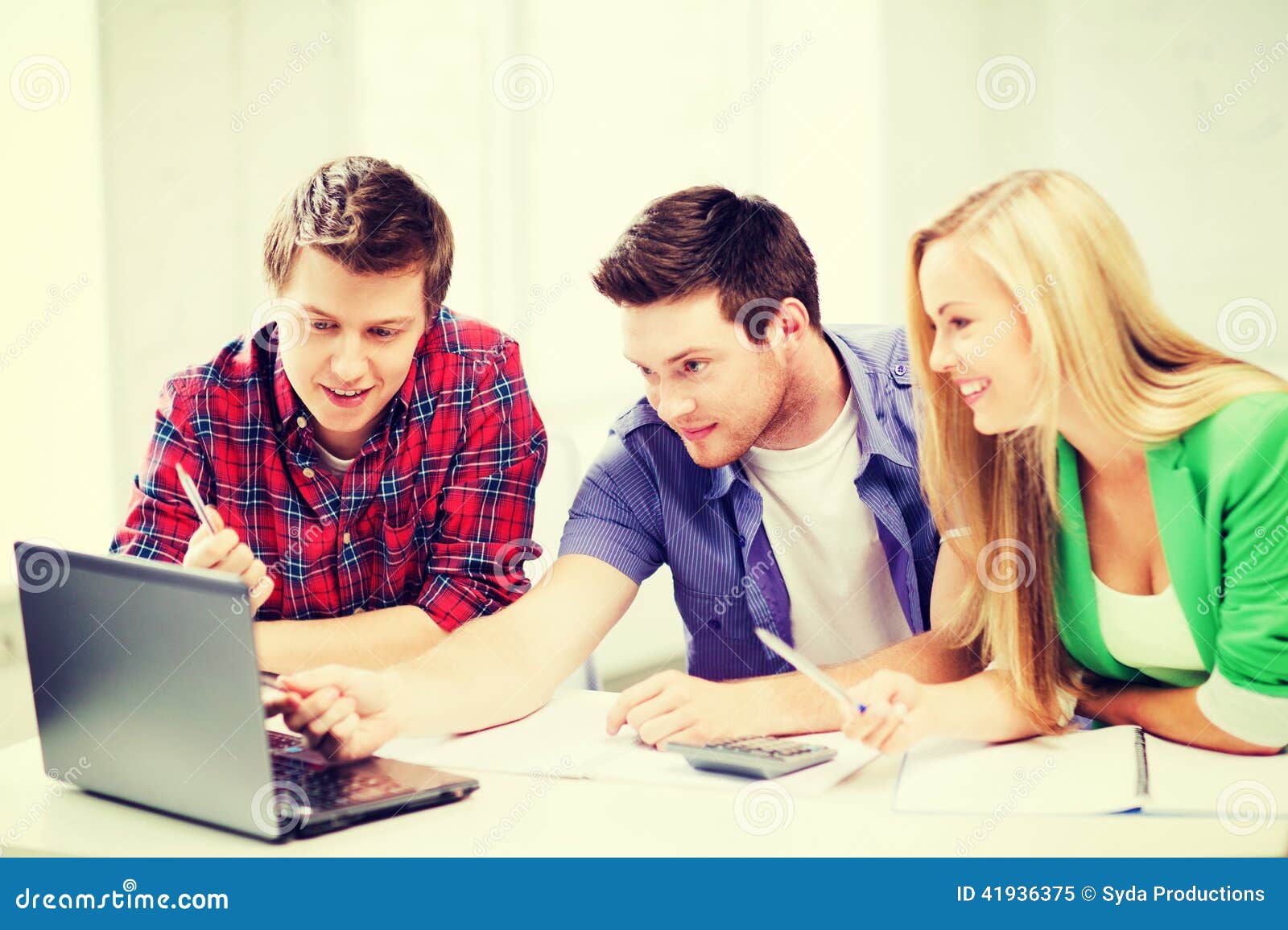 Smiling Students Looking at Laptop at School Stock Image - Image of ...