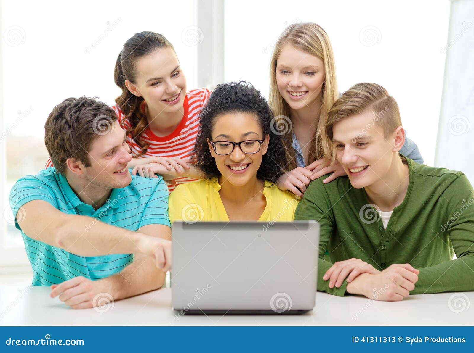 Smiling Students Looking at Laptop at School Stock Image - Image of ...