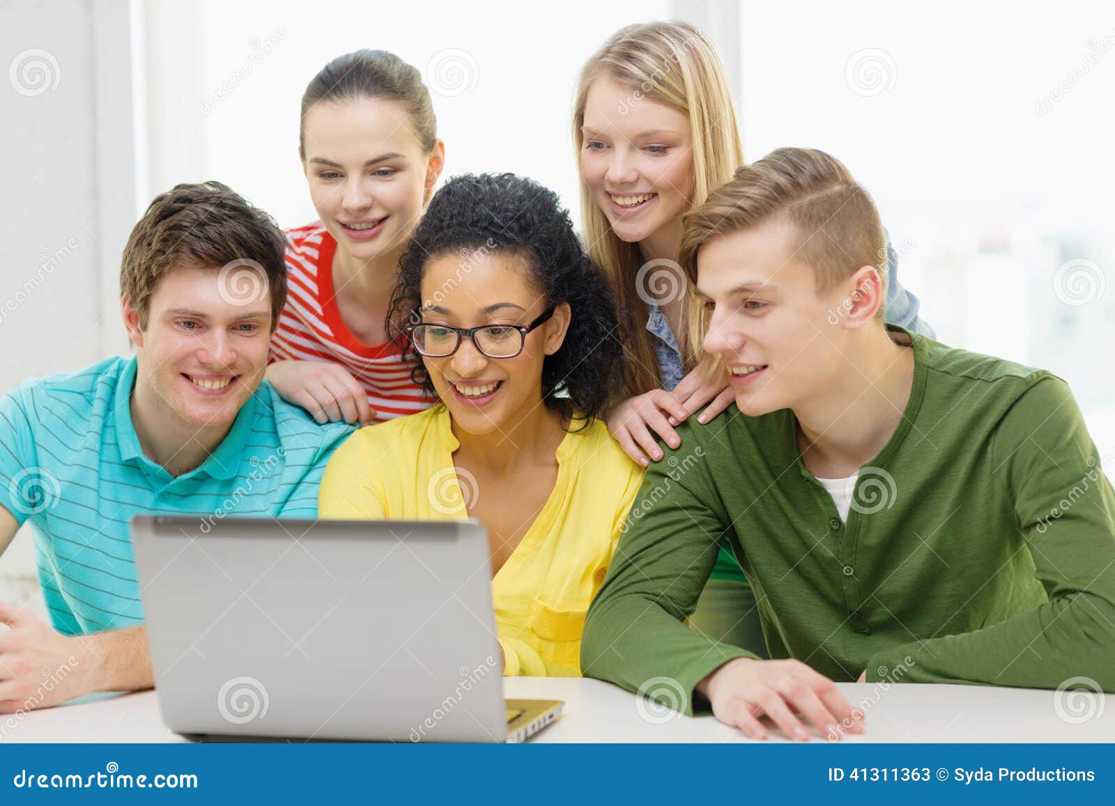 Smiling Students Looking at Laptop at School Stock Image - Image of ...