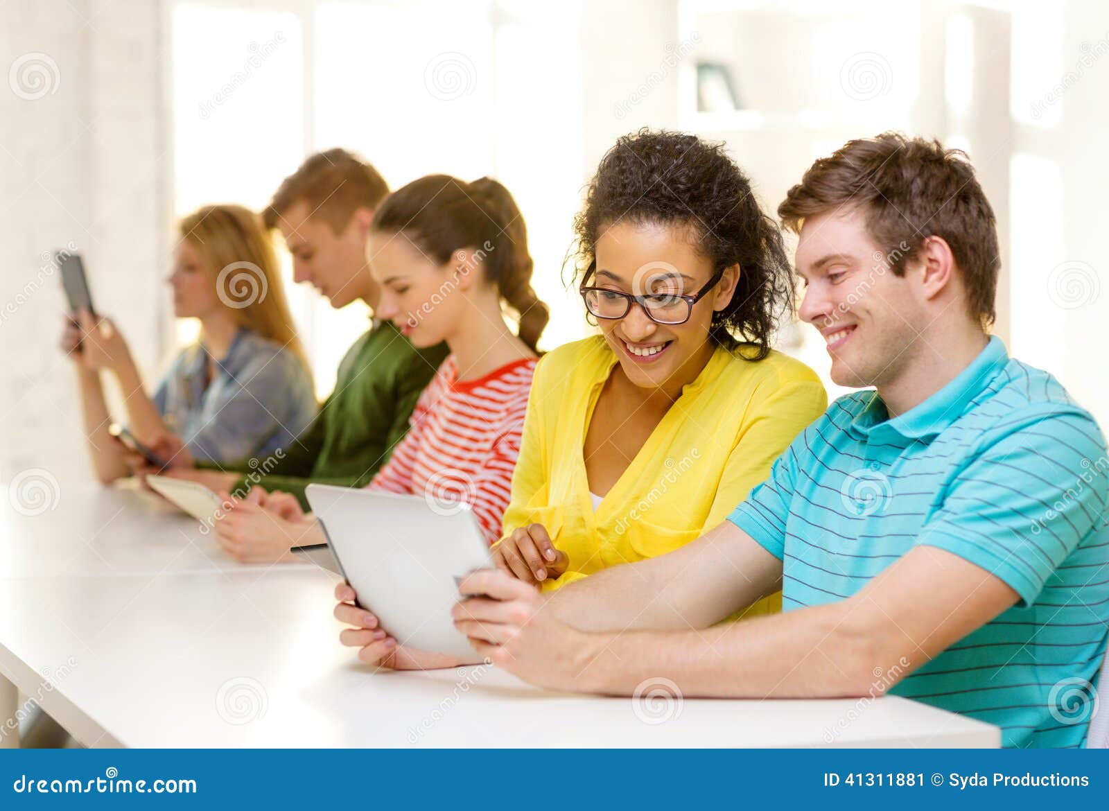 Smiling Students Looking at Tablet Pc at School Stock Image - Image of ...