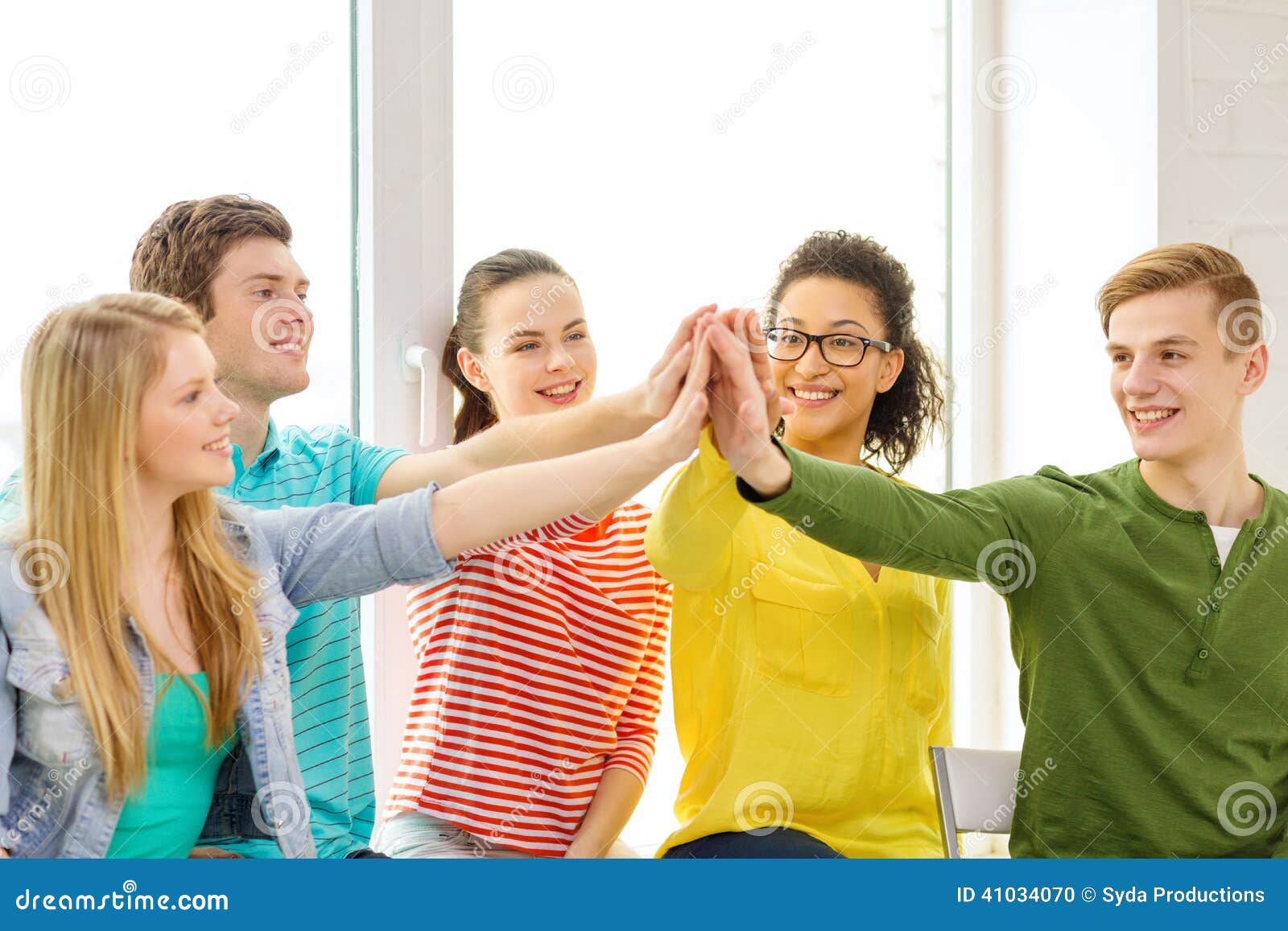 Smiling Students Making High Five Gesture Sitting Stock Photo - Image ...