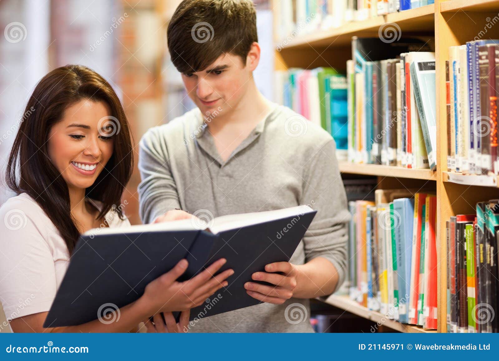 Smiling Students Reading a Book Stock Image - Image of prepare ...