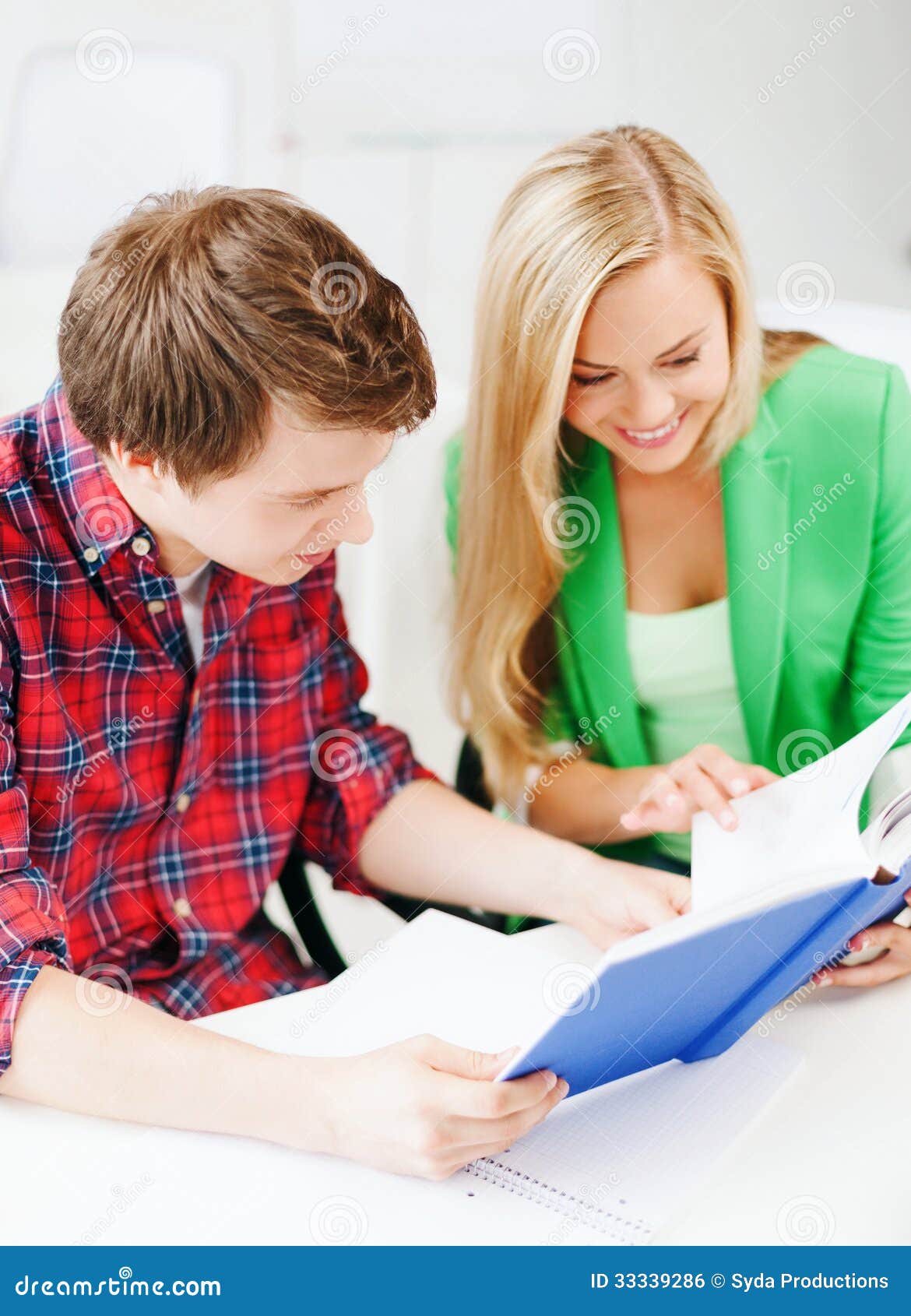 Smiling Students Reading Book at School Stock Photo - Image of girl ...