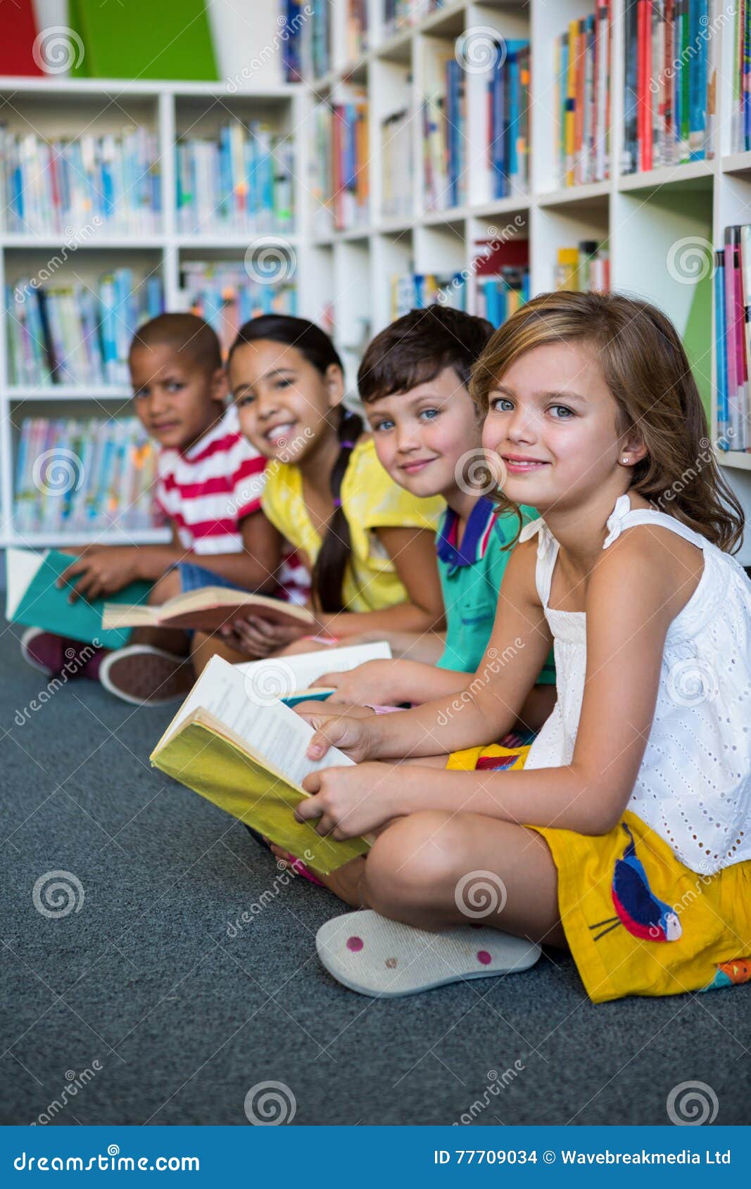 Smiling Students Sitting at Library in School Stock Photo - Image of ...