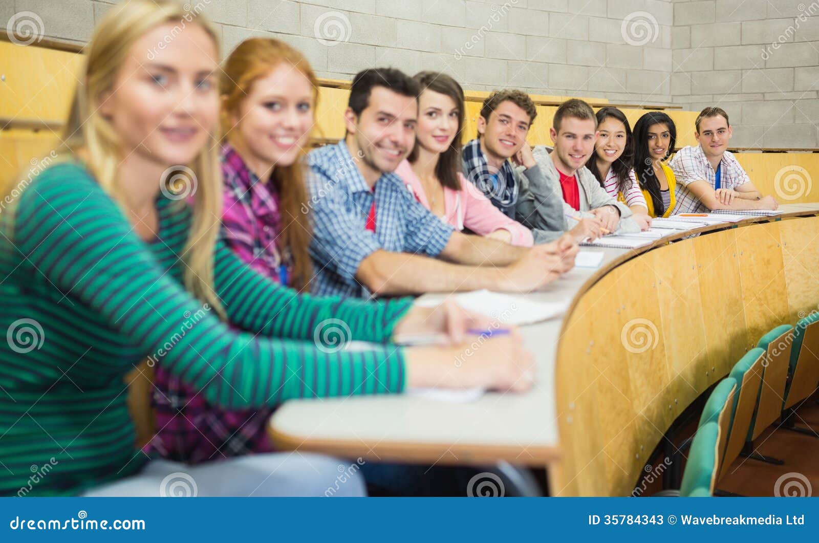 Smiling Students Sitting in a Row at Lecture Hall Stock Image - Image ...
