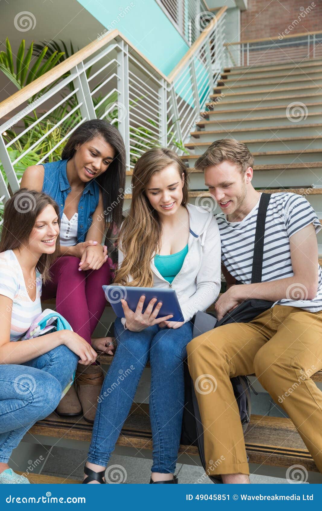 Smiling Students Sitting on Steps with Tablet Pc Stock Image - Image of ...