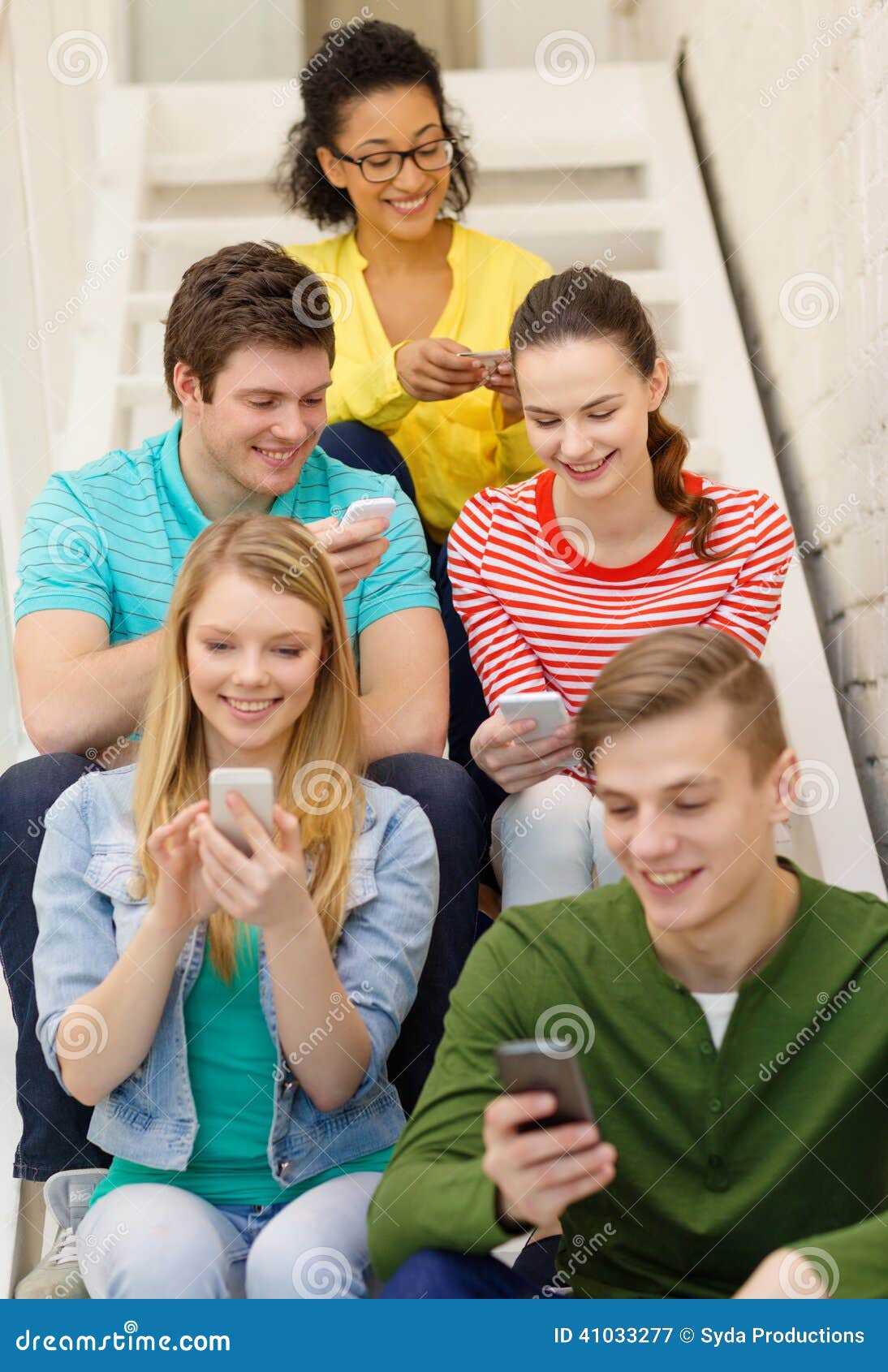 Smiling Students with Smartphone Texting at School Stock Image - Image ...