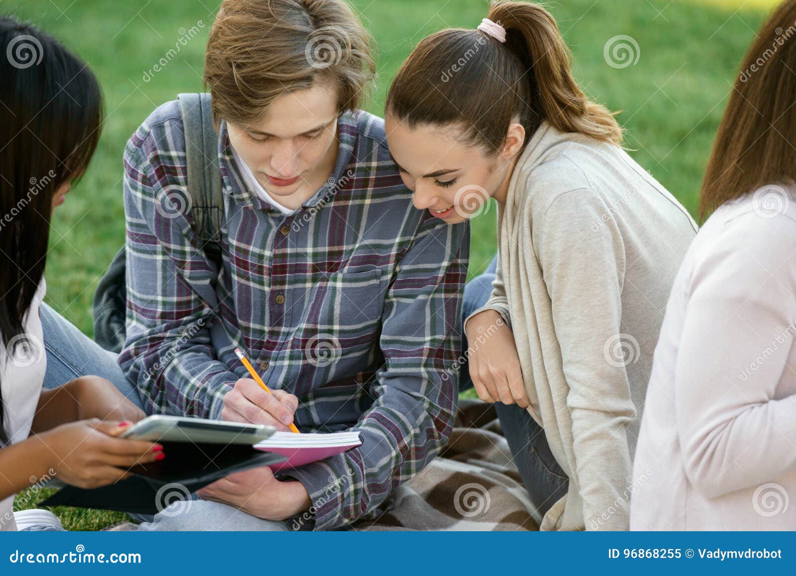 Smiling Students Studying Outdoors. Looking Aside Stock Image - Image ...